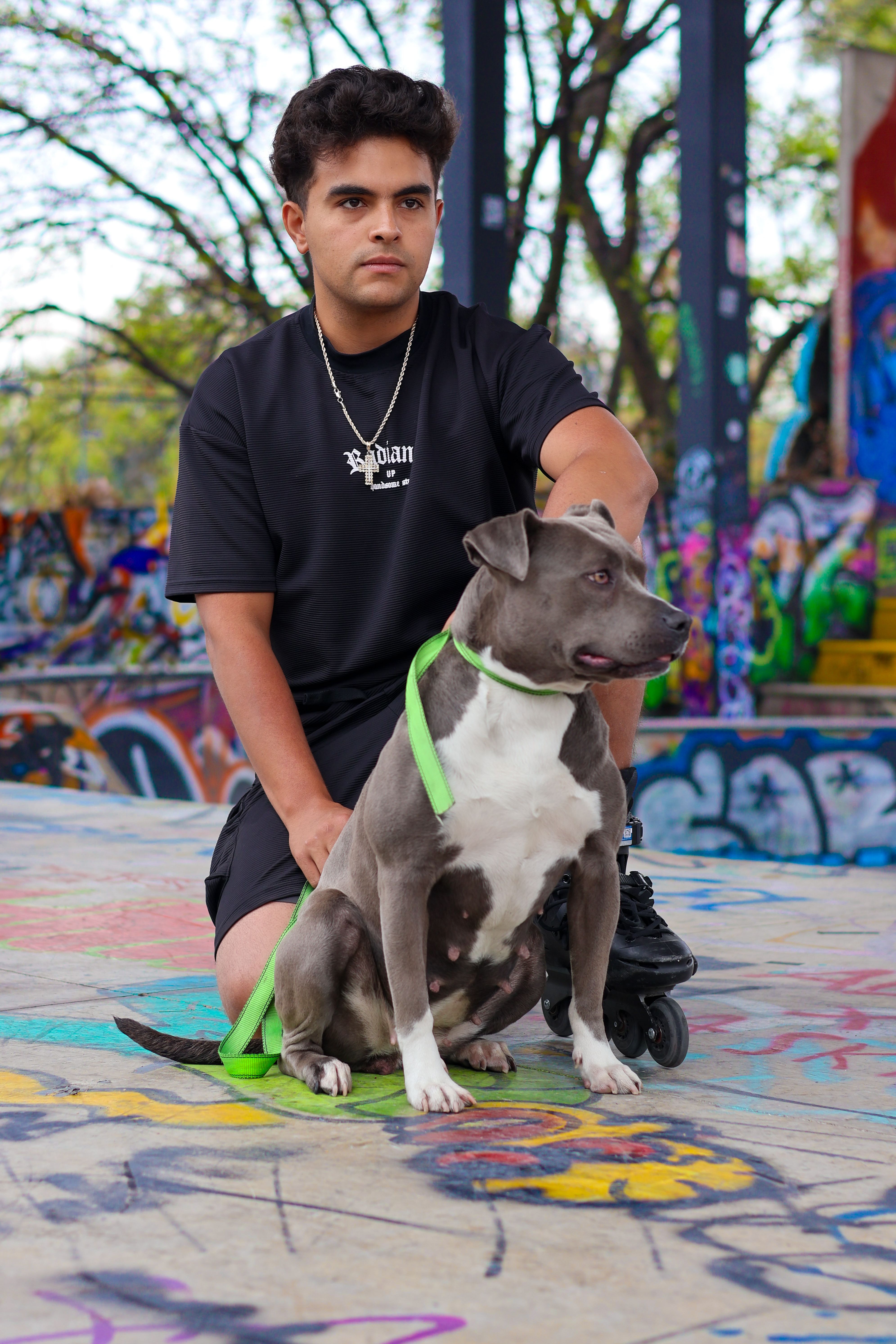 Urban Portrait of Young Man with Pit Bull · Free Stock Photo