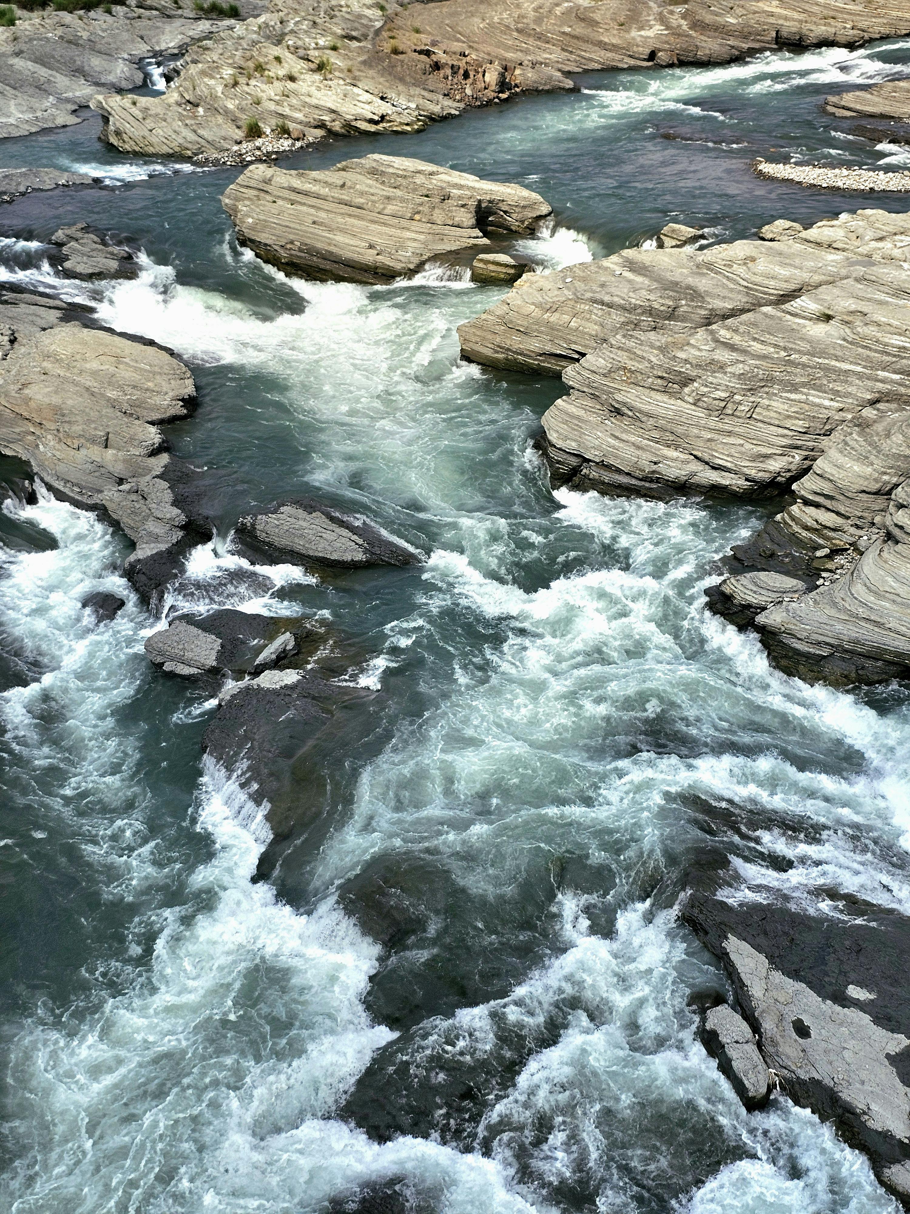 Churning Rapids Flowing Through Rocky Landscape · Free Stock Photo