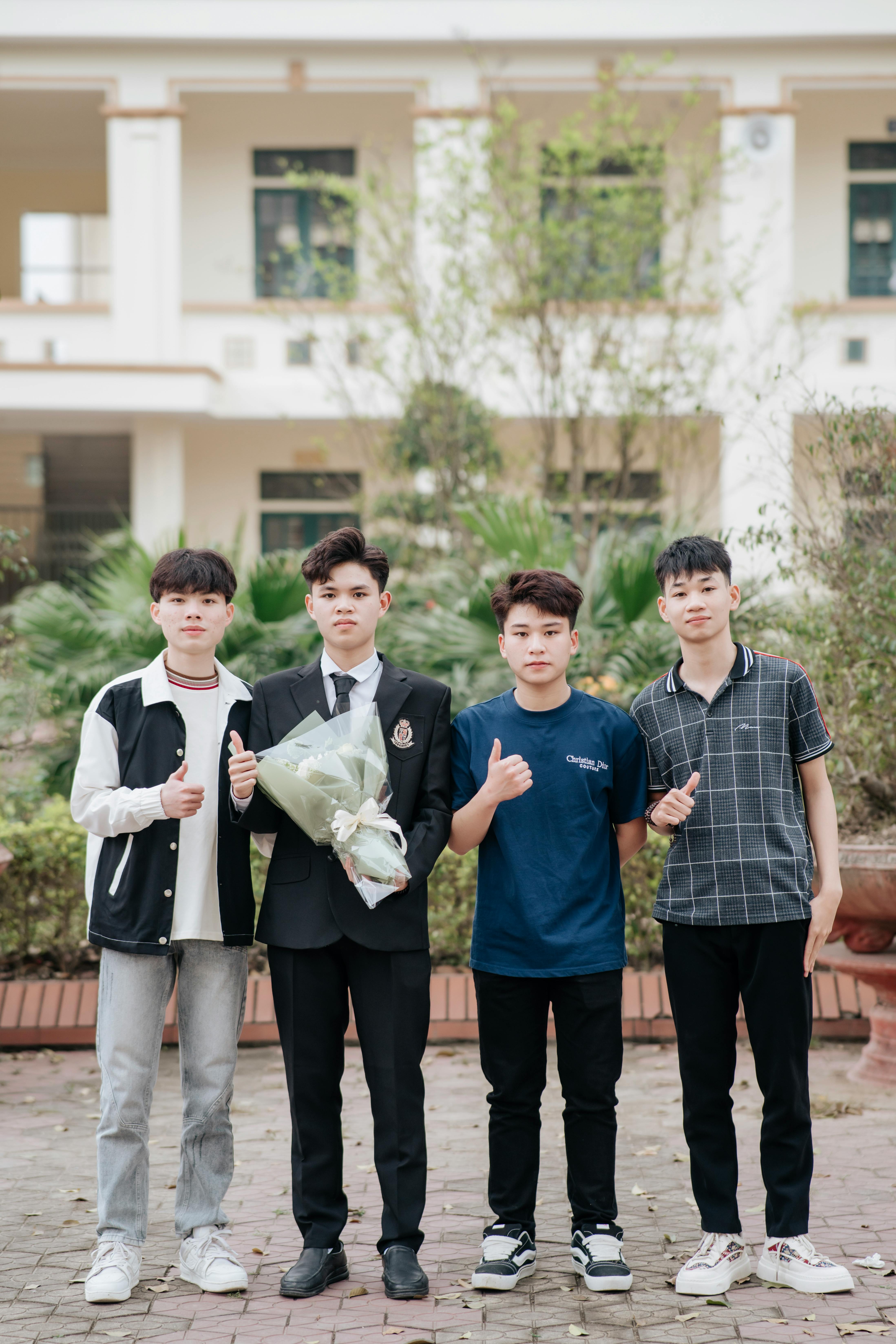 Group of Teenage Boys Posing Outdoors · Free Stock Photo