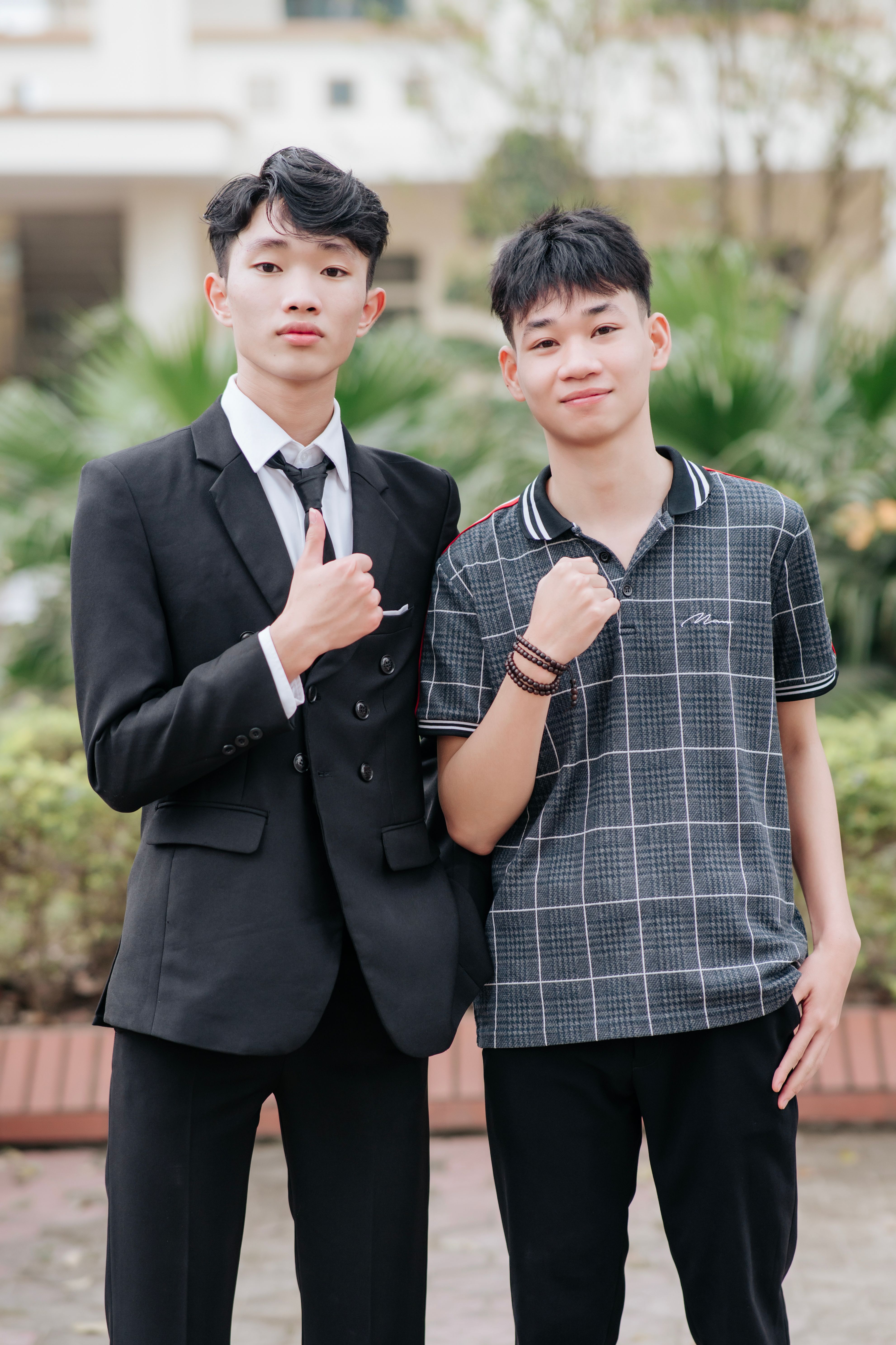Two Young Men in Formal Suits Outdoors · Free Stock Photo