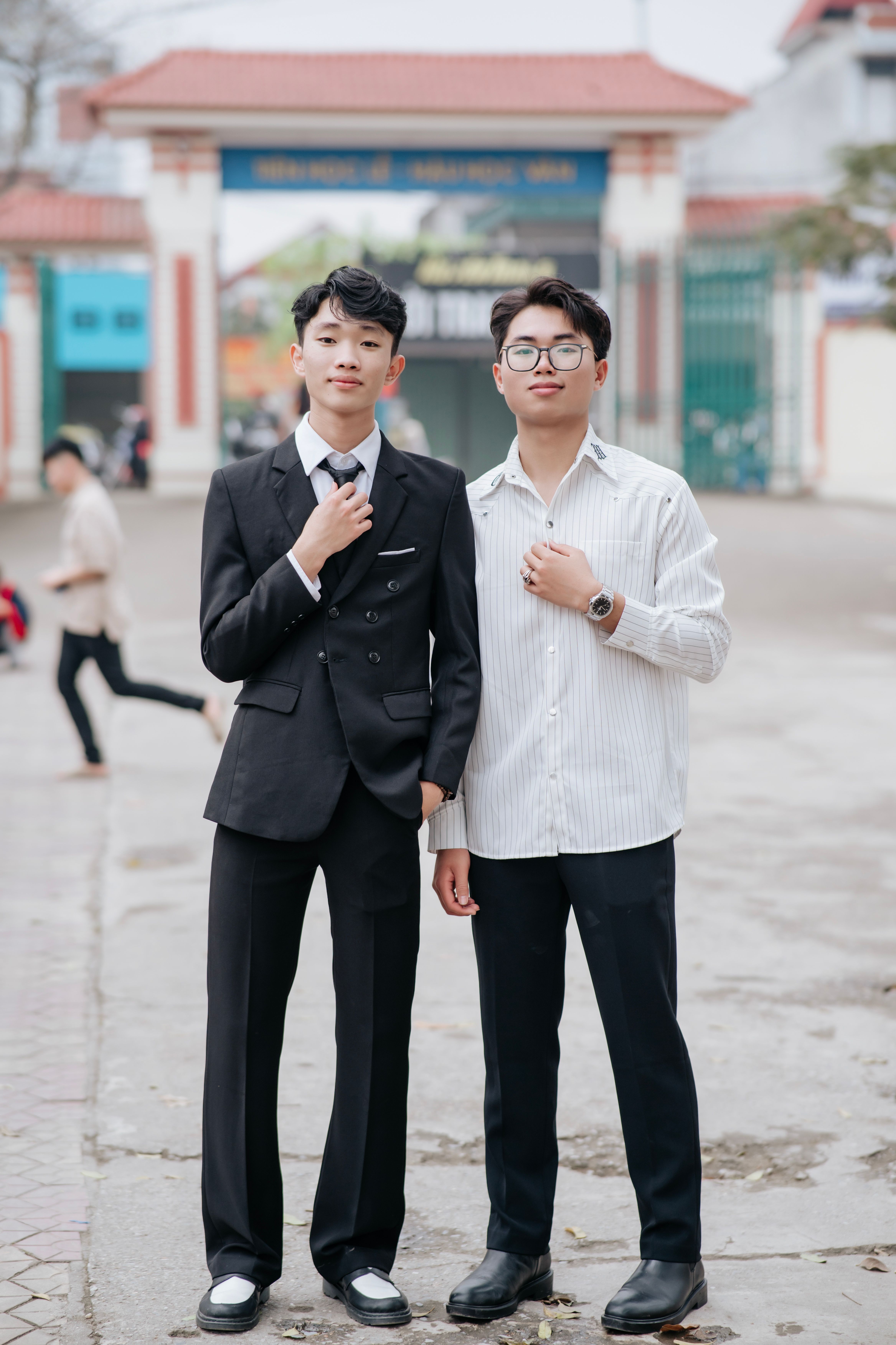 Two Young Men Posing in School Uniforms Outdoors · Free Stock Photo