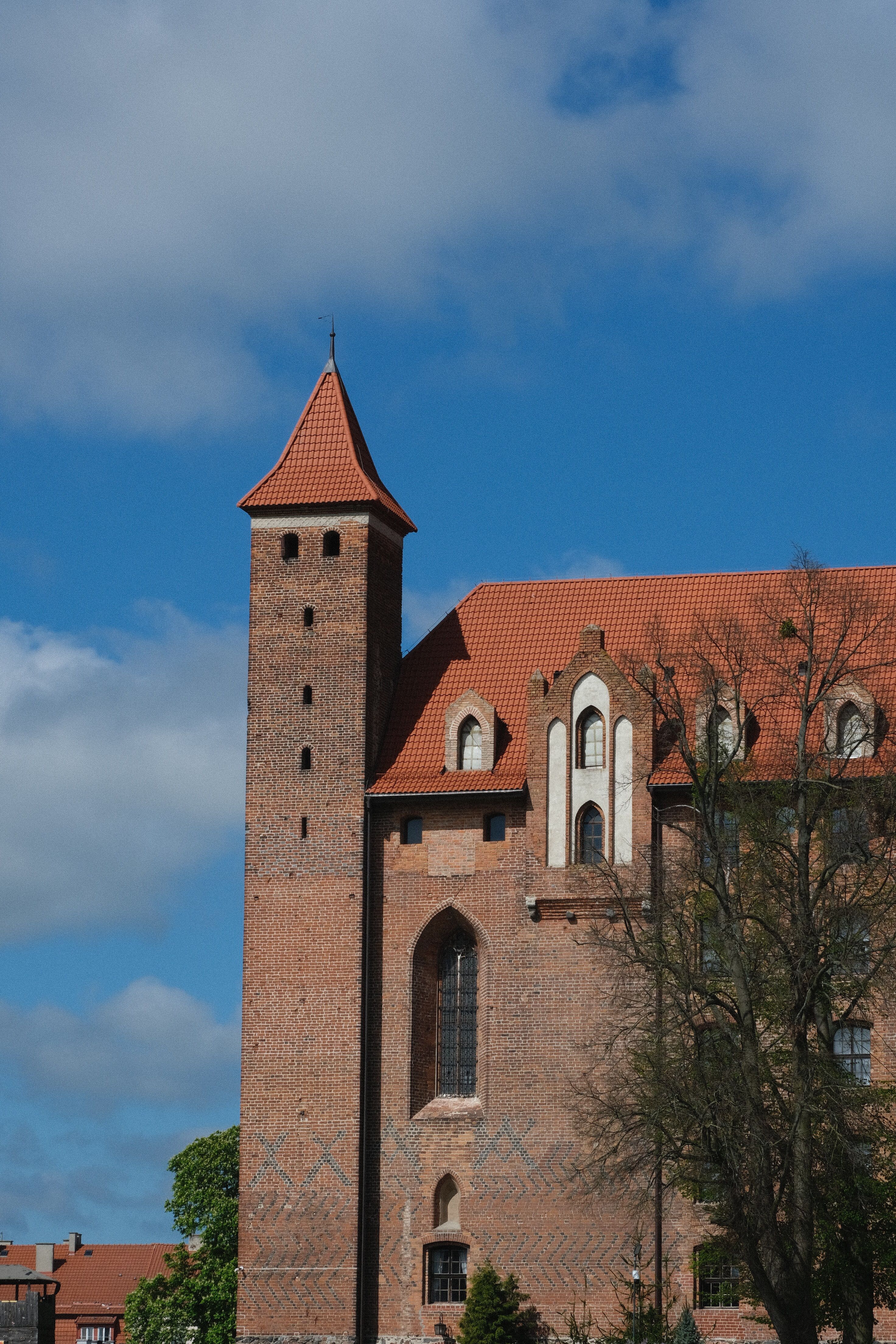 Medieval Brick Architecture Against Blue Sky · Free Stock Photo