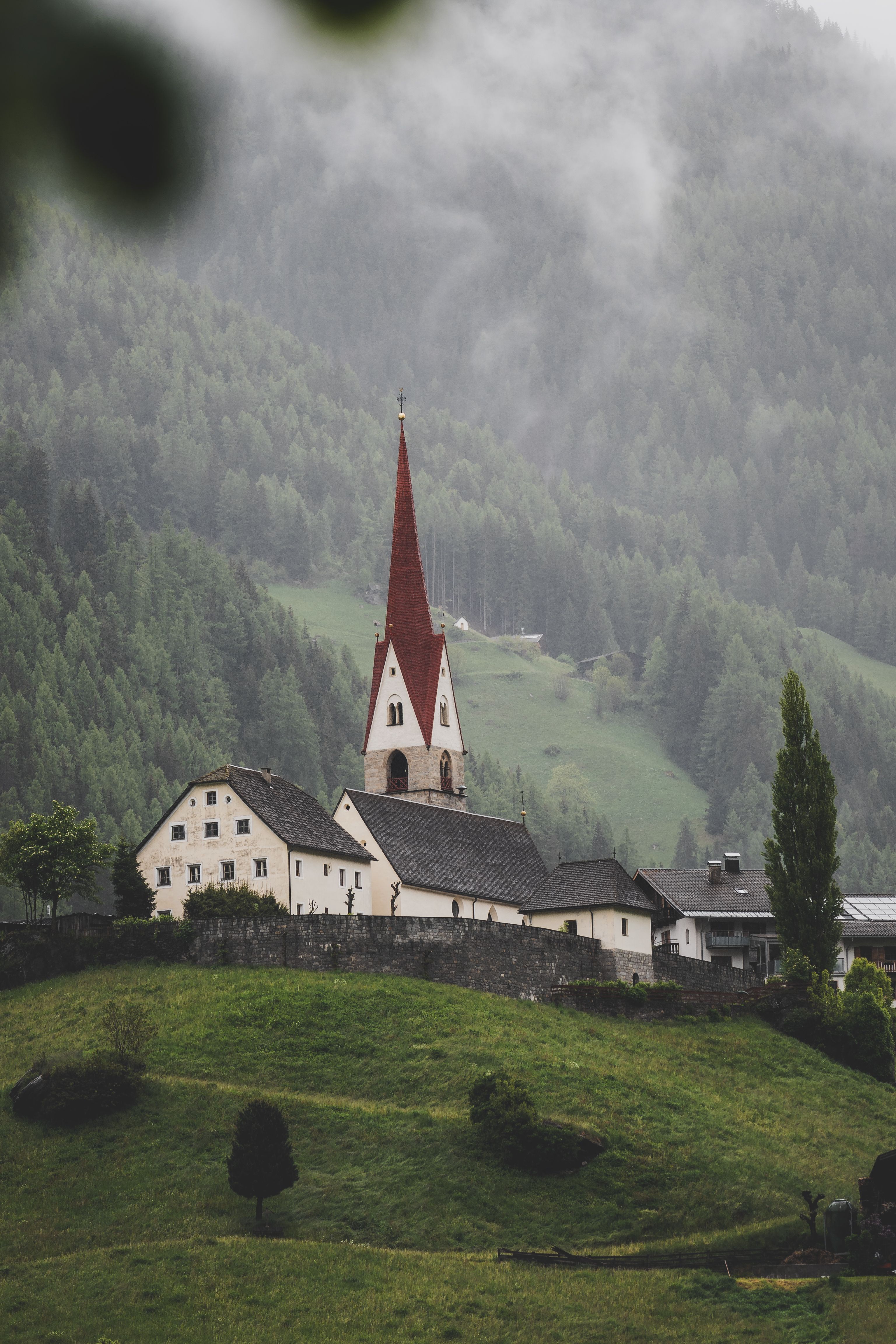Charming Alpine Village with Church Steeple · Free Stock Photo