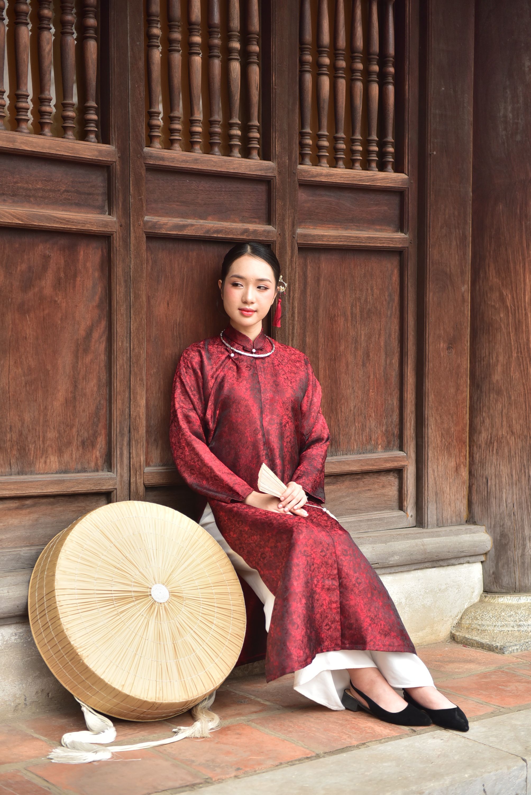 Traditional Asian Attire in Cultural Setting · Free Stock Photo