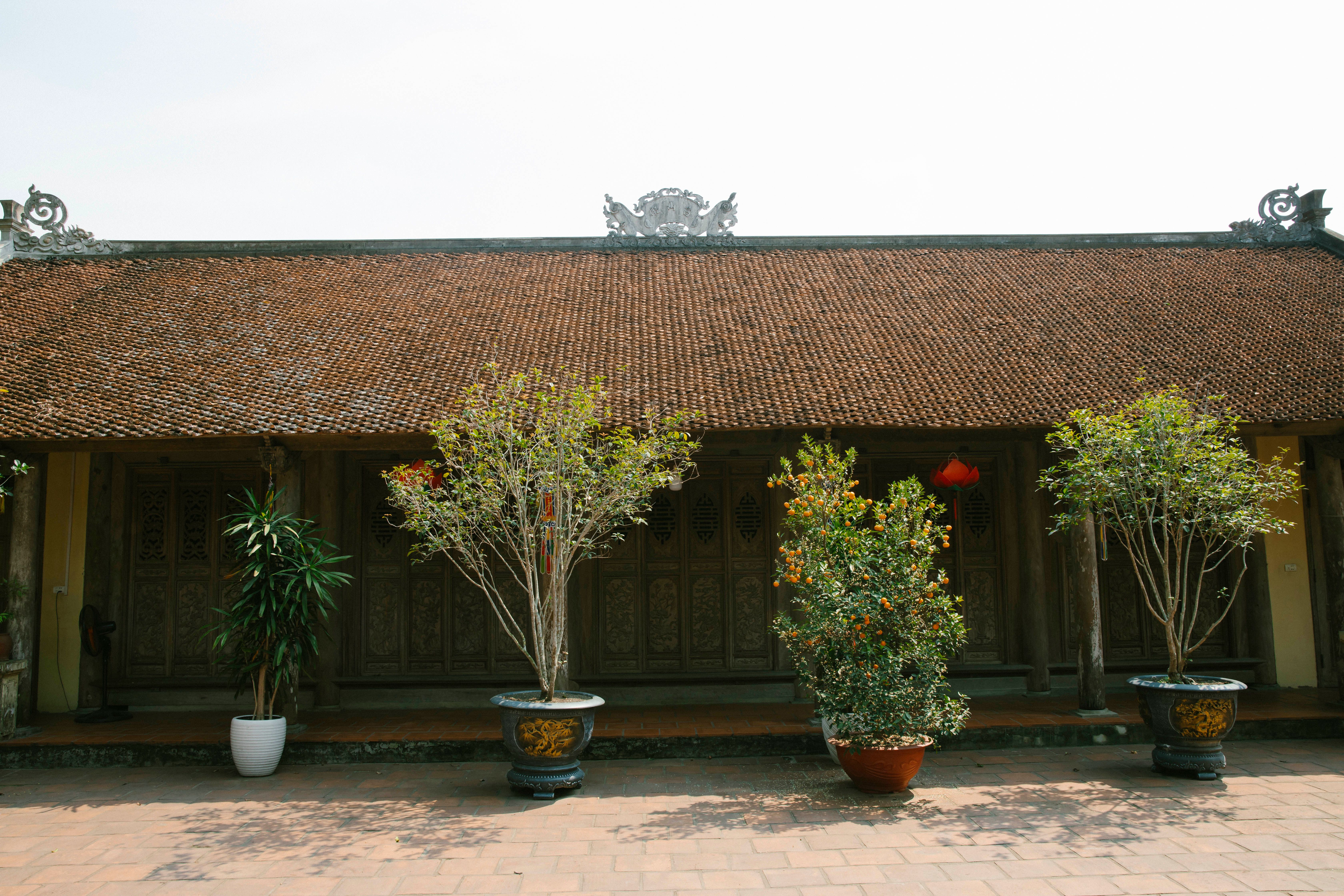 Traditional Southeast Asian Wooden Temple Architecture · Free Stock Photo