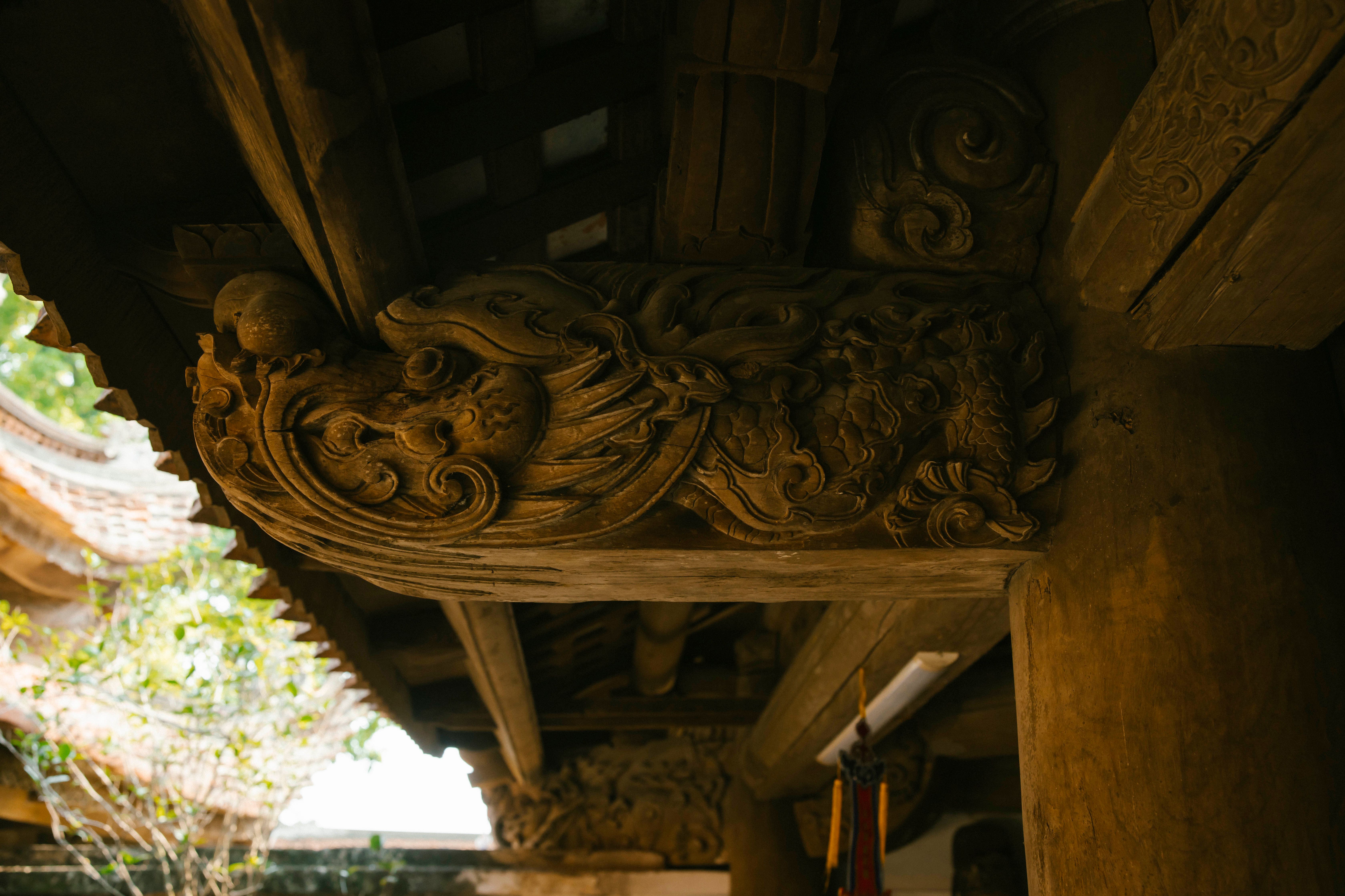 Intricate Wood Carving in Traditional Architecture · Free Stock Photo