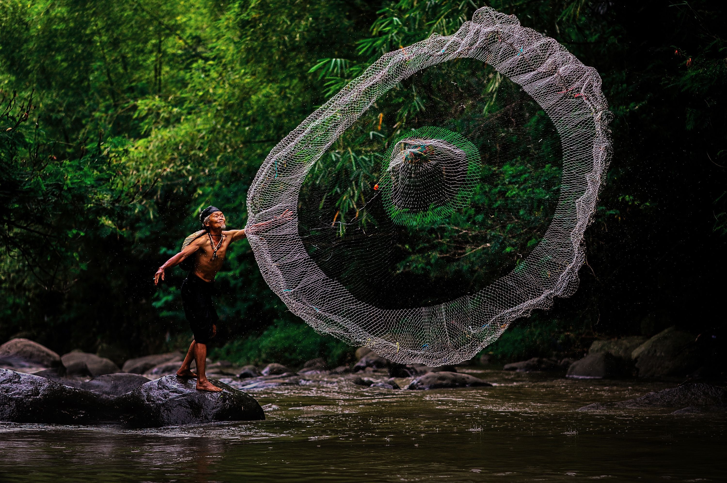Person Standing with Colorful Net in Lake · Free Stock Photo