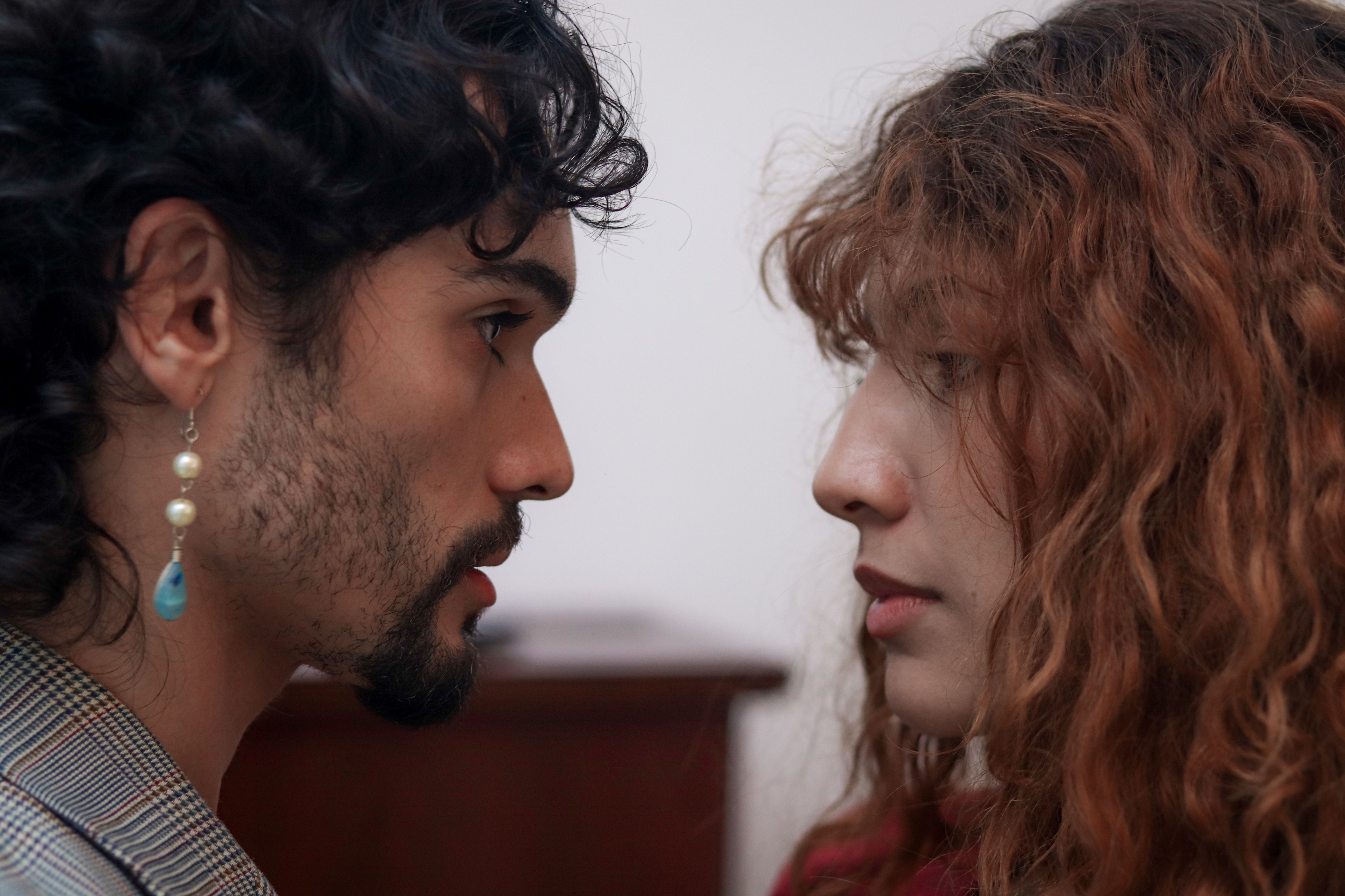 Close-Up Portrait of Two People Facing Each Other · Free Stock Photo