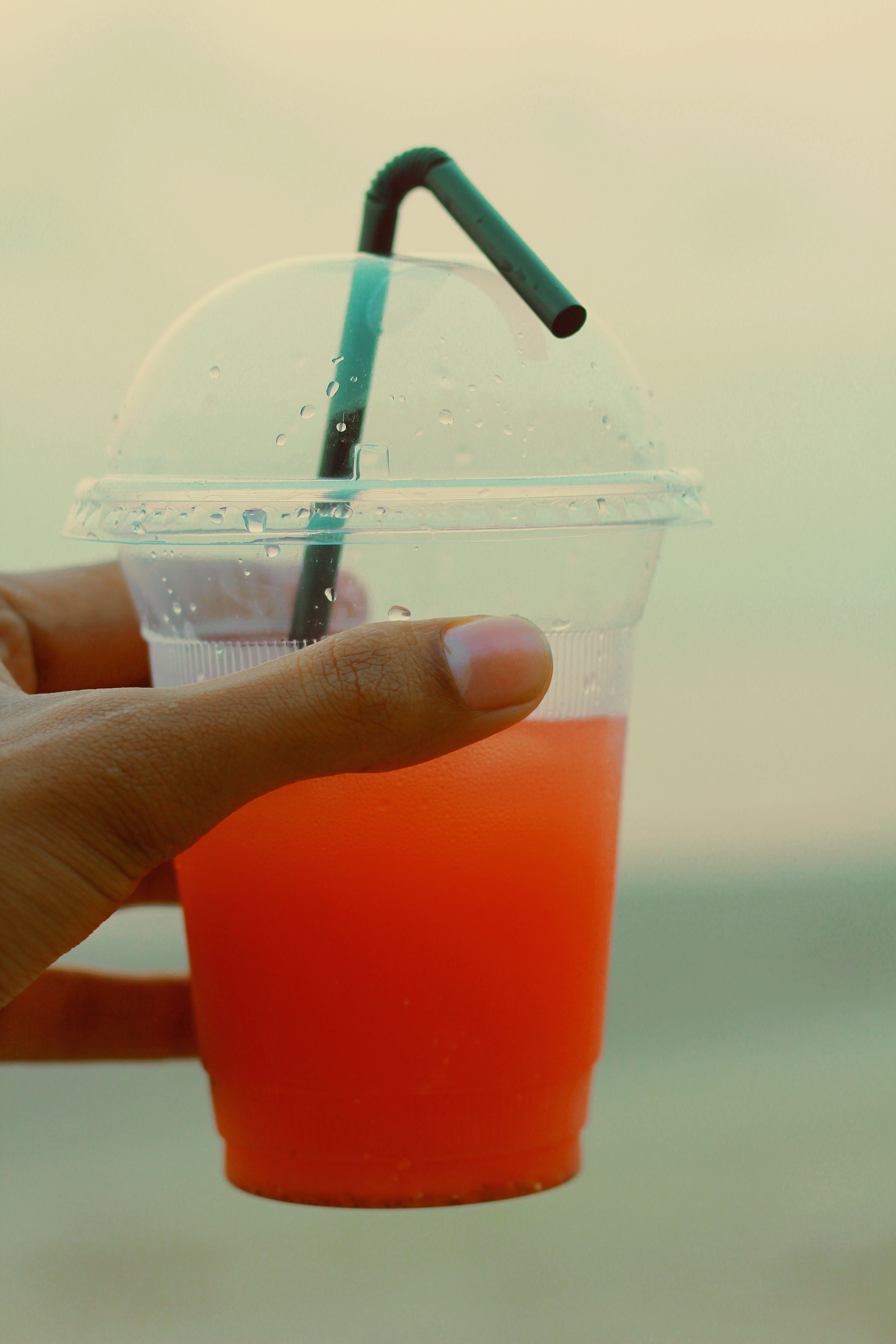 Refreshing Summer Drink in Clear Plastic Cup · Free Stock Photo