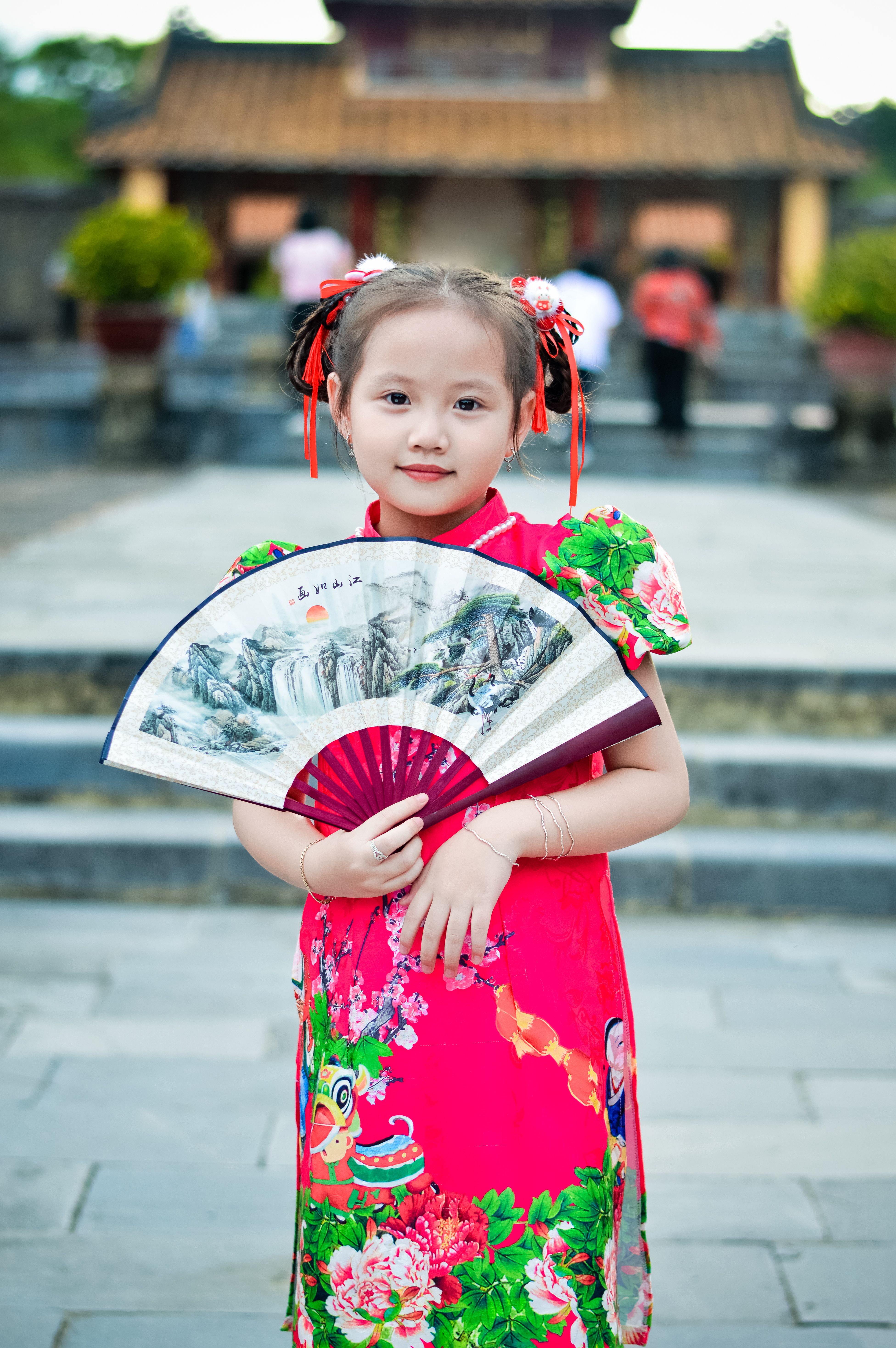 Young Girl in Traditional Dress at Asian Temple · Free Stock Photo