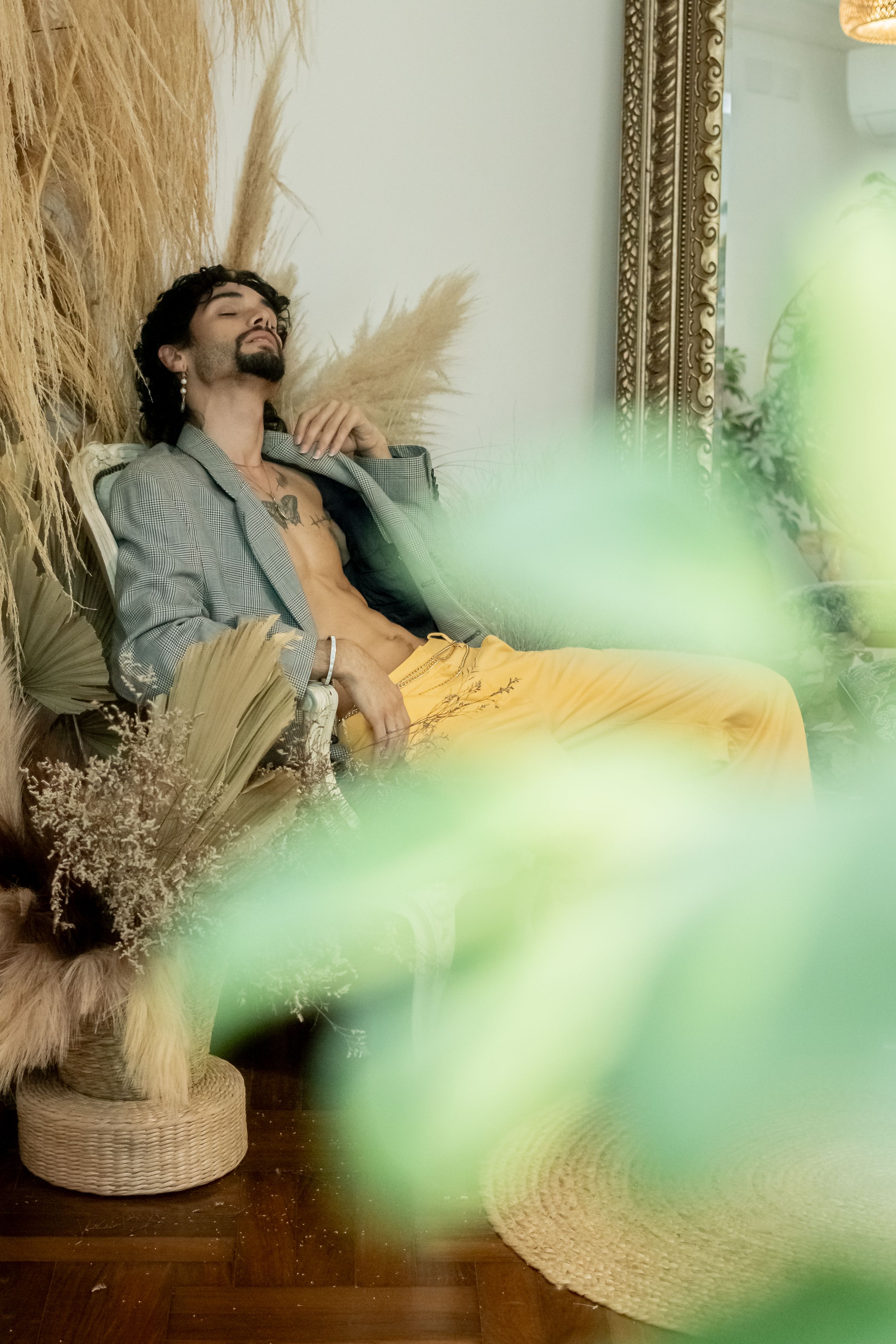 Relaxed Man Amongst Indoor Bohemian Decor · Free Stock Photo