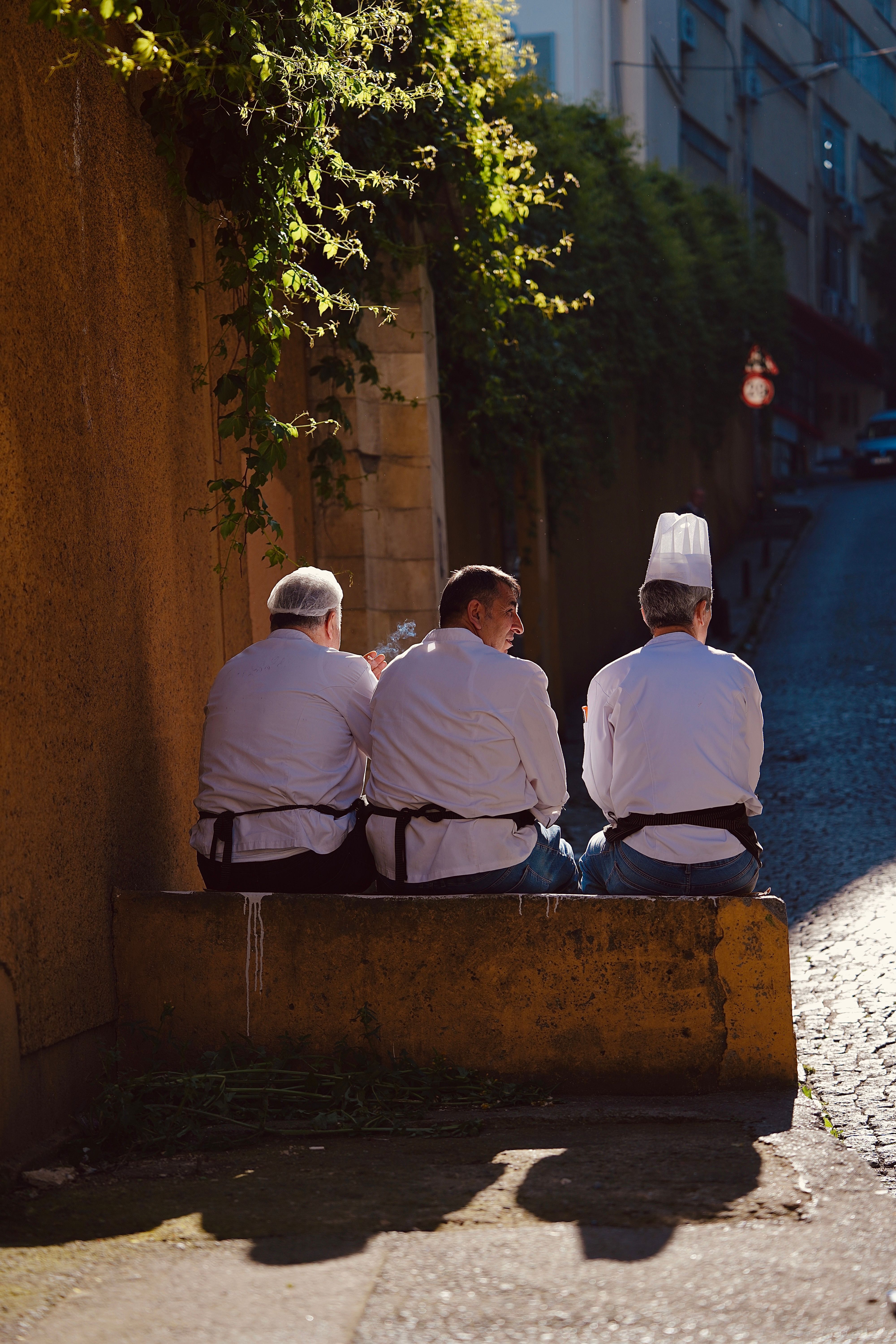 Chefs on Break in Urban Alleyway · Free Stock Photo