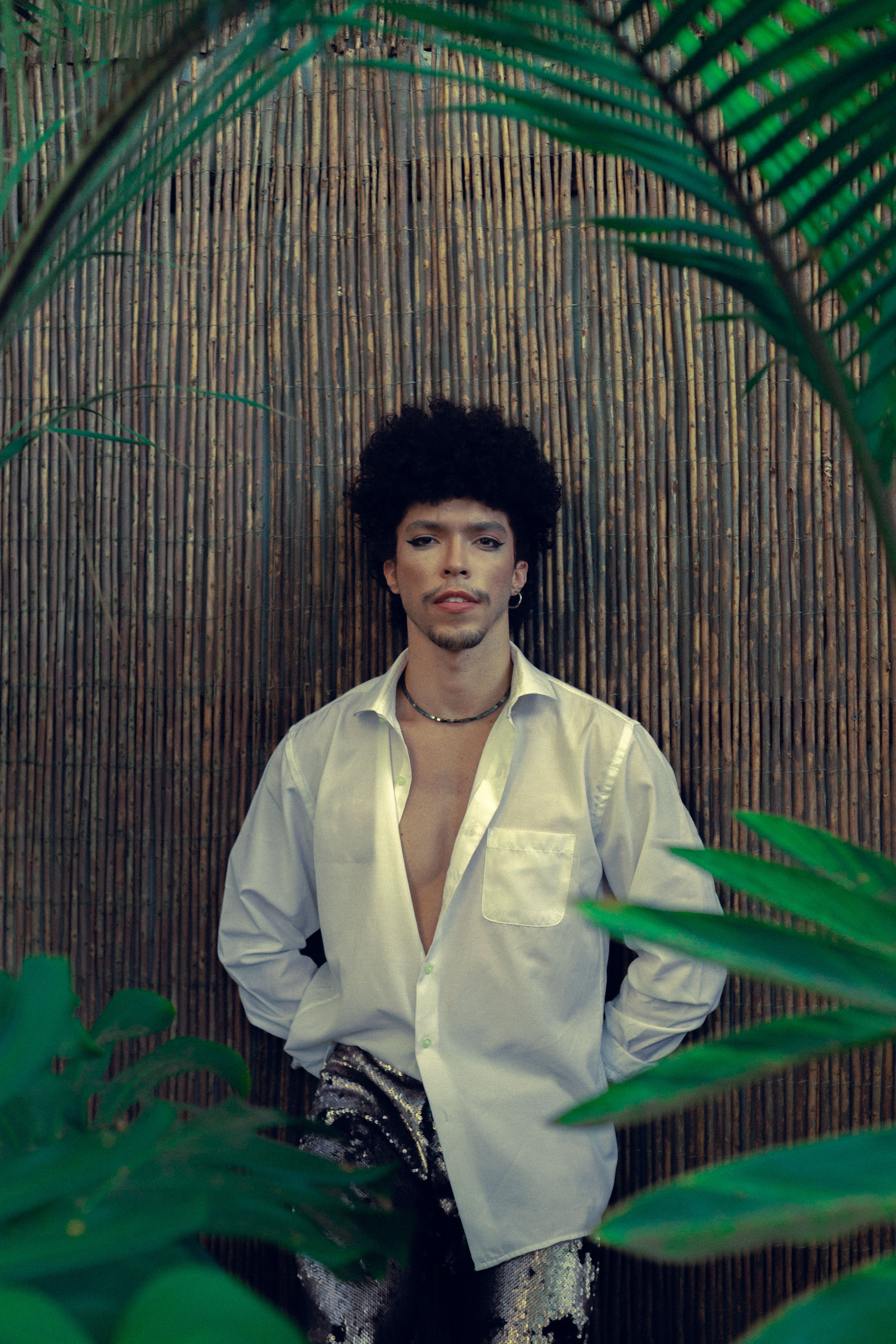 Stylish Individual Posing in Tropical Setting · Free Stock Photo