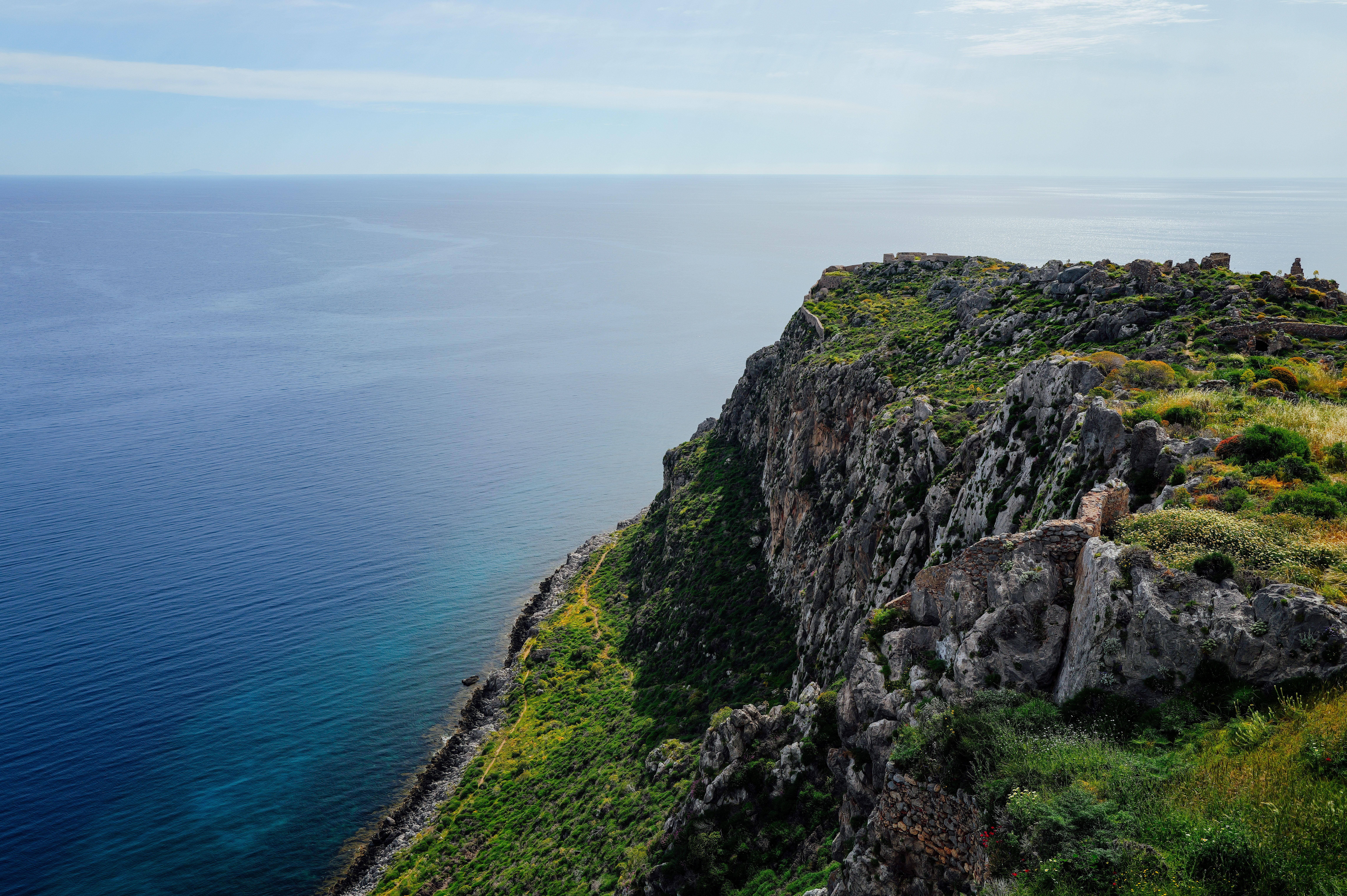 Stunning Coastal Cliff Overlooking Blue Ocean · Free Stock Photo