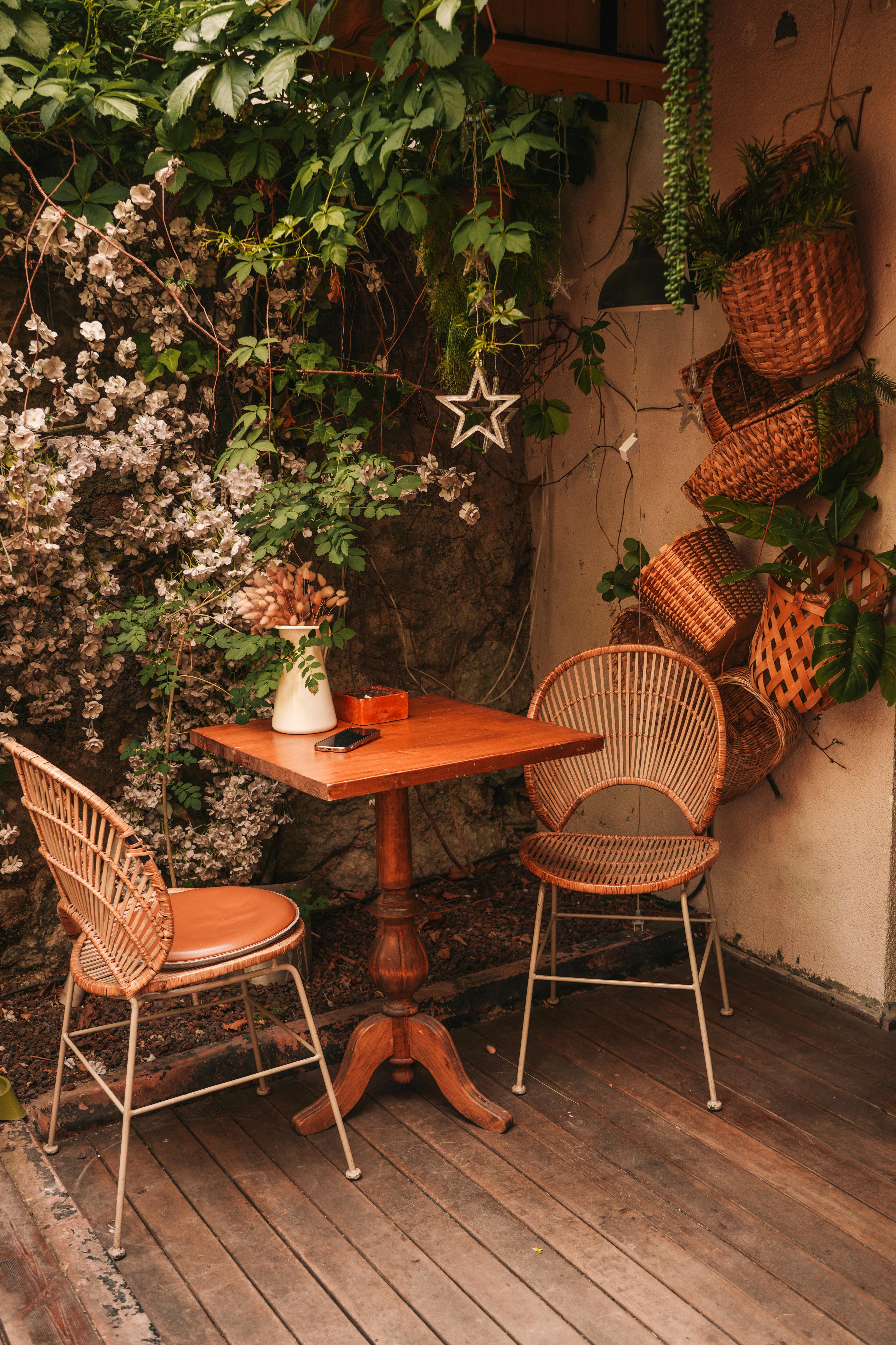 Cozy Outdoor Café Seating with Rustic Decor · Free Stock Photo