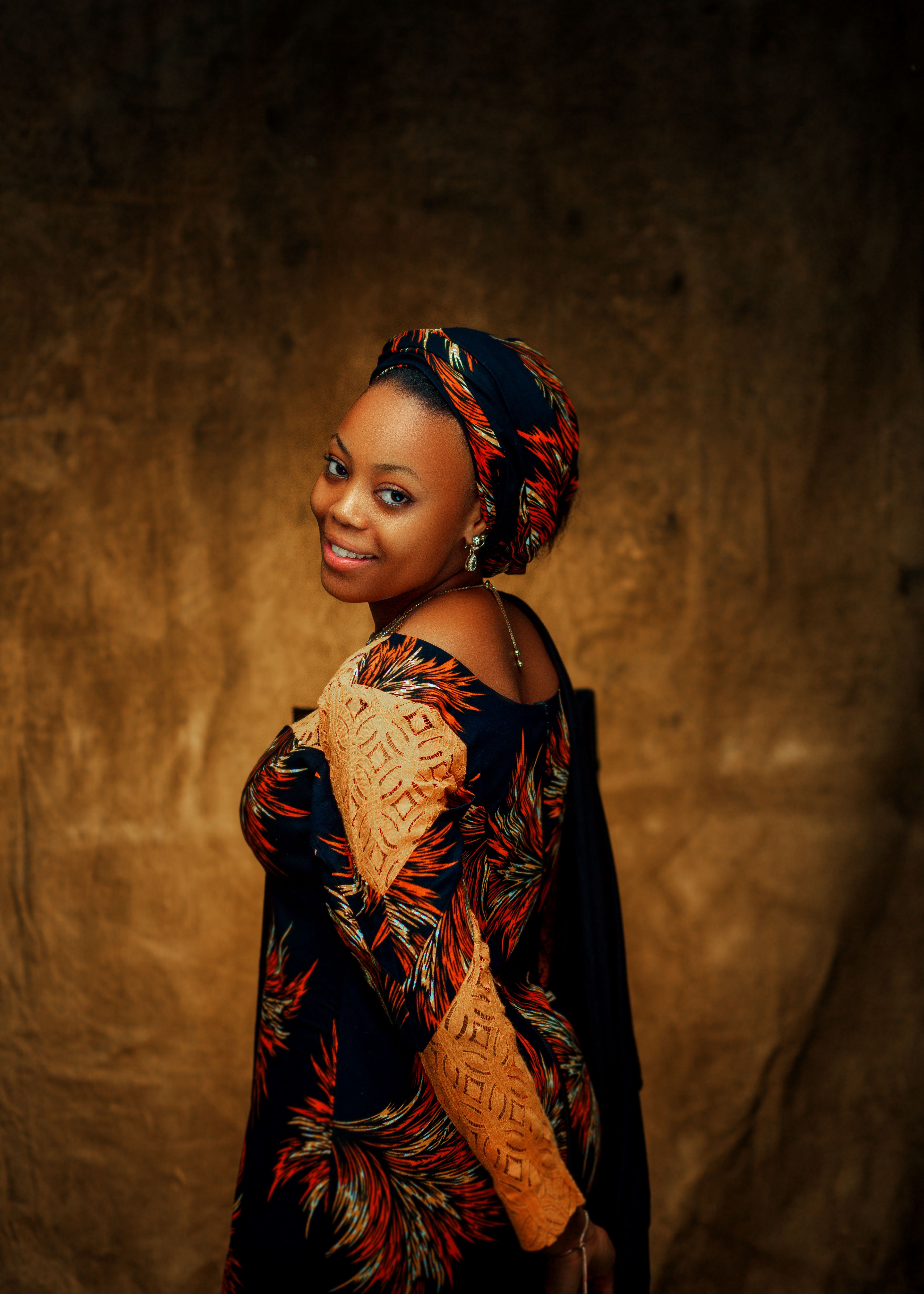 Traditional African Attire Worn by Smiling Women Indoors · Free Stock Photo