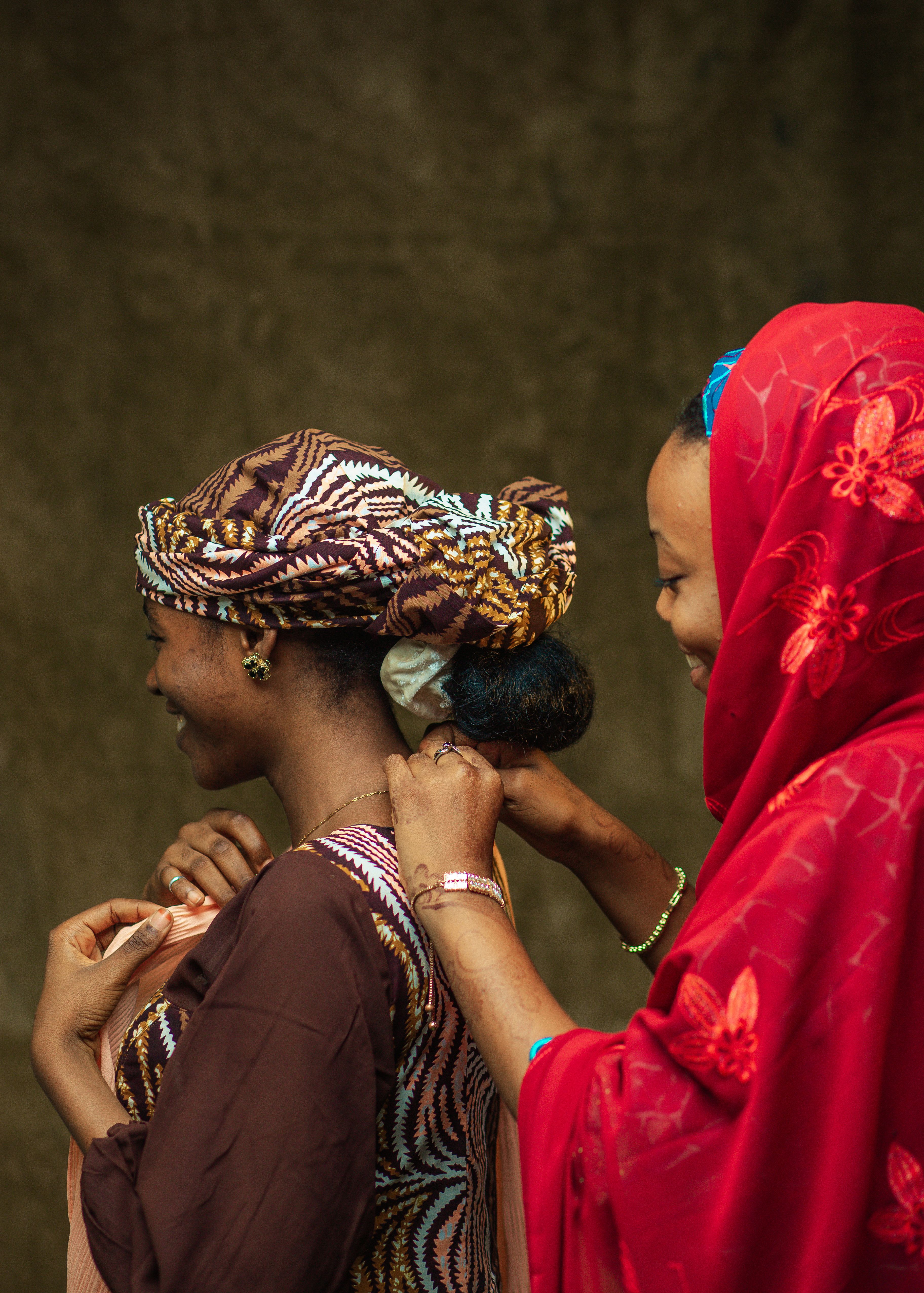 African Women in Traditional Attire Preparing for Celebration · Free ...