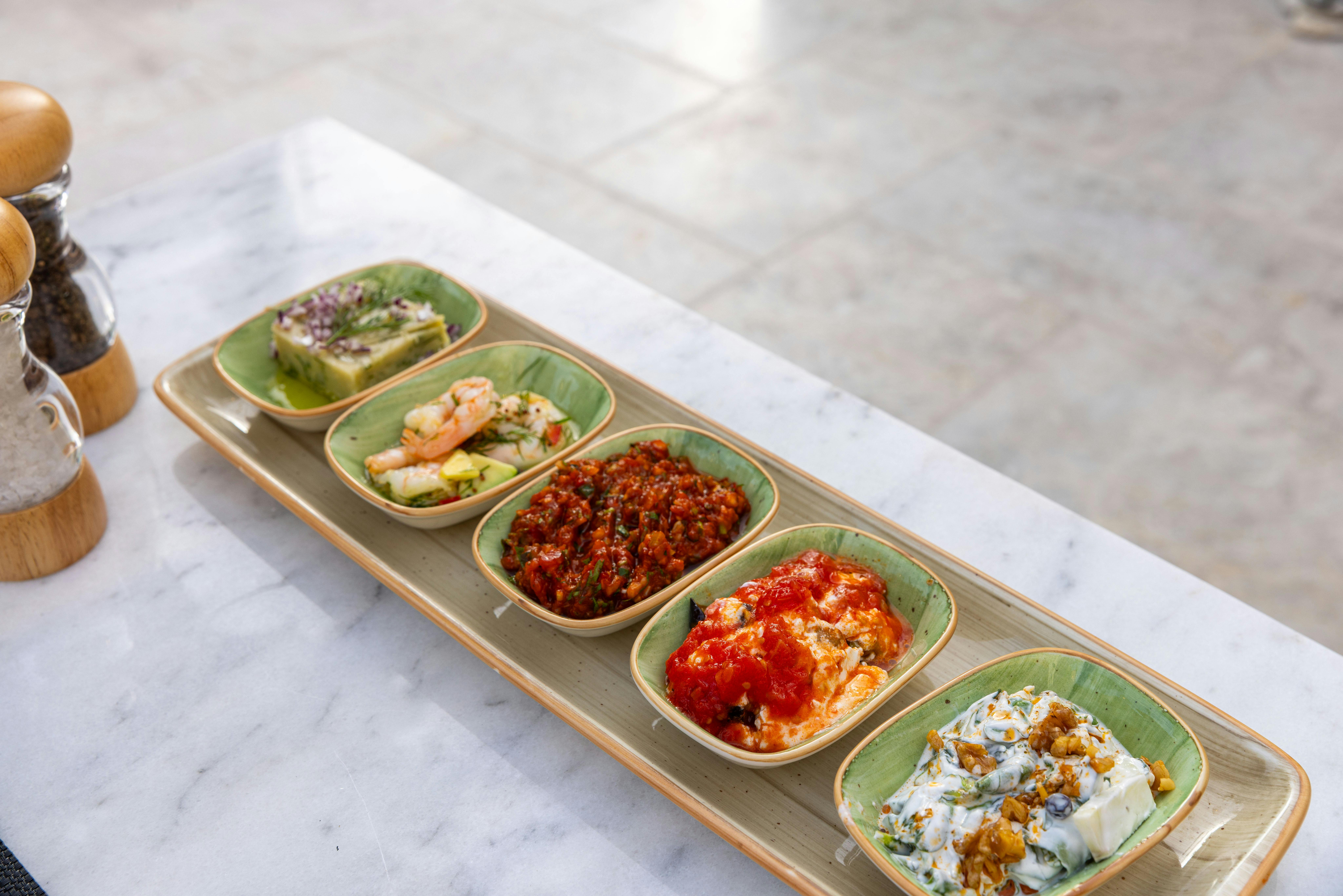 Elegant Assorted Dips on Marble Table · Free Stock Photo