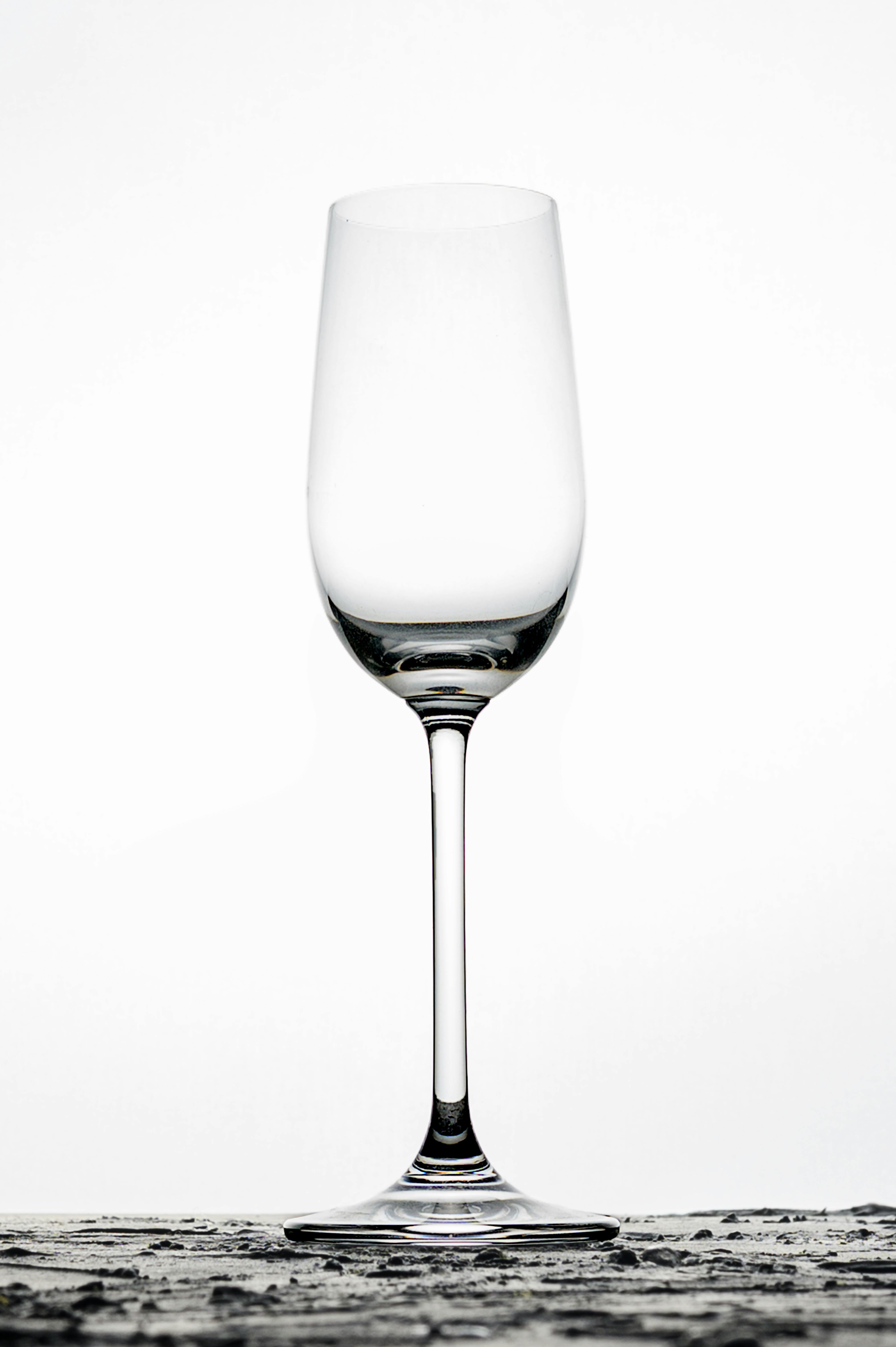 Elegant Empty Wine Glass on Textured Surface · Free Stock Photo