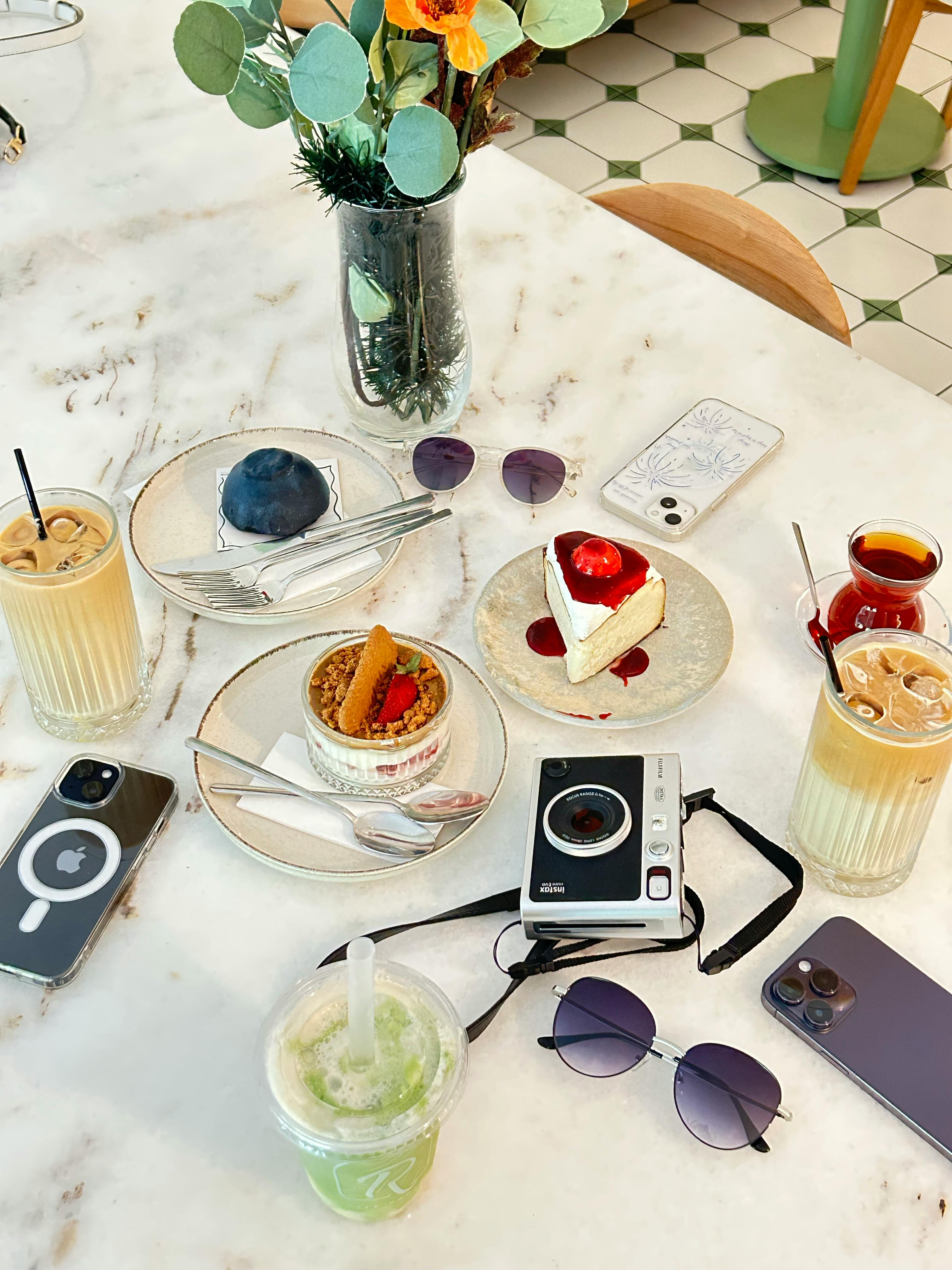 Elegant Café Table Setting with Desserts and Drinks · Free Stock Photo
