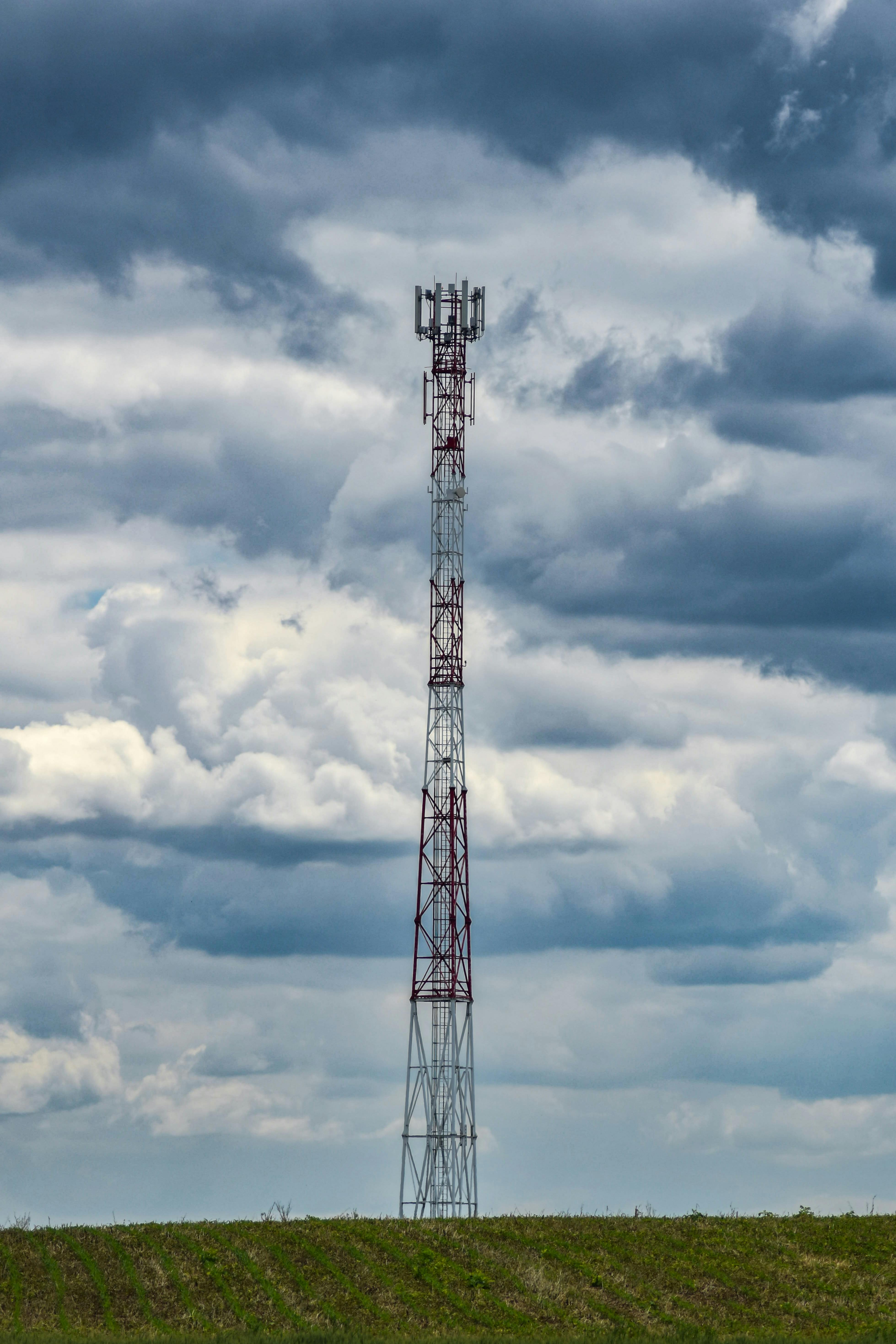 Telecommunication Tower Against Dramatic Cloudy Sky · Free Stock Photo
