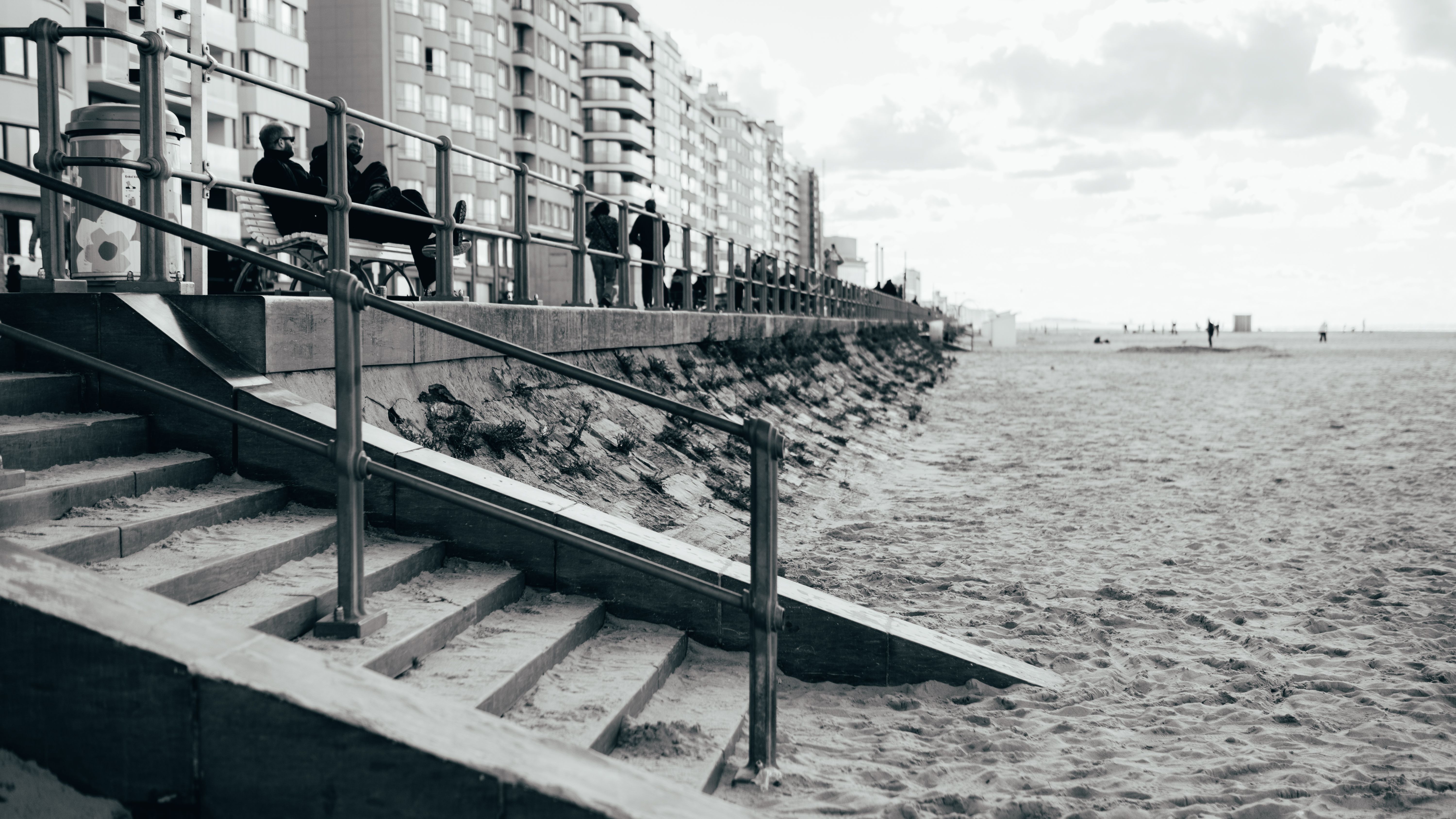 Black and White Beachfront Promenade Scene · Free Stock Photo