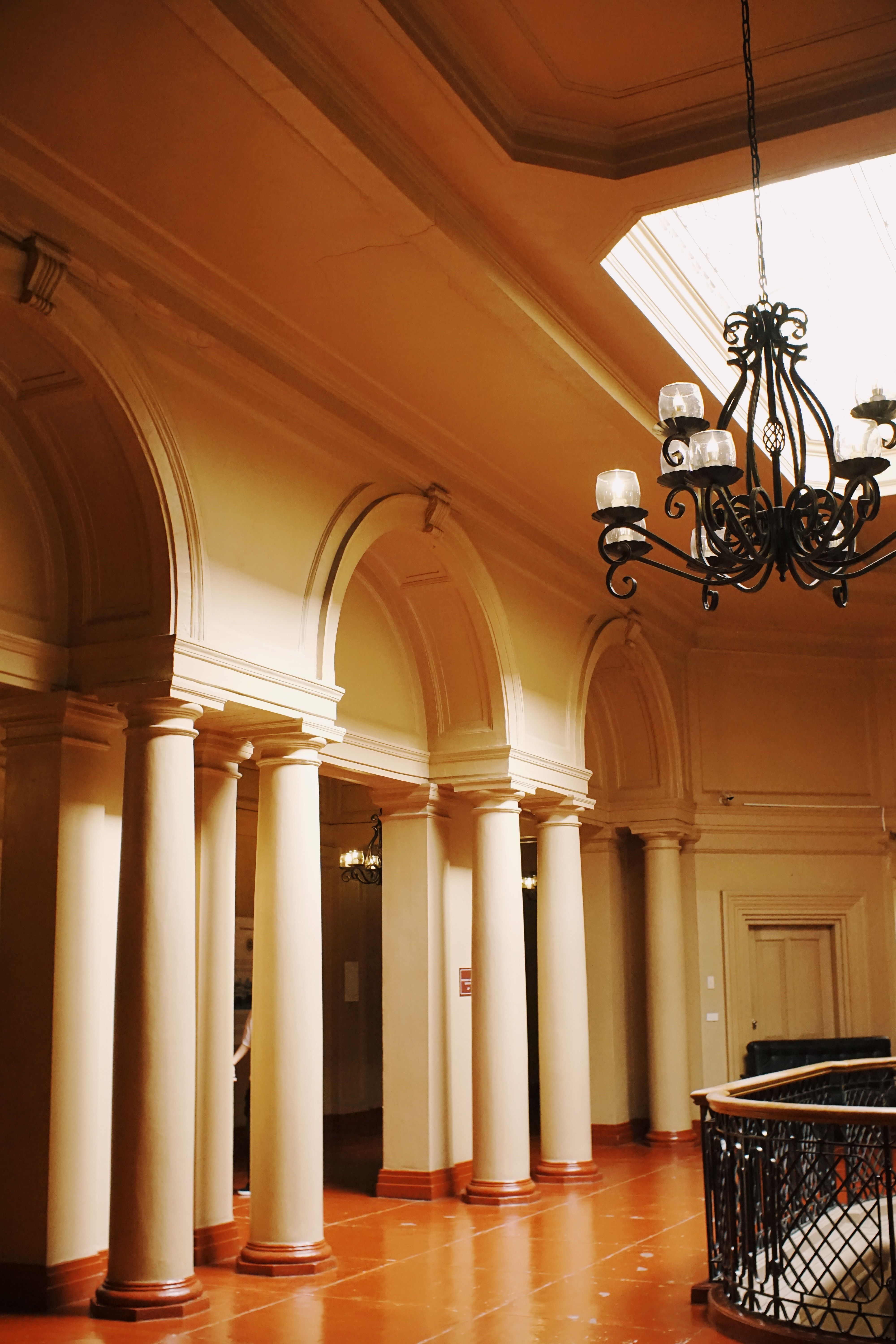 Old building interior with stairs and columns · Free Stock Photo