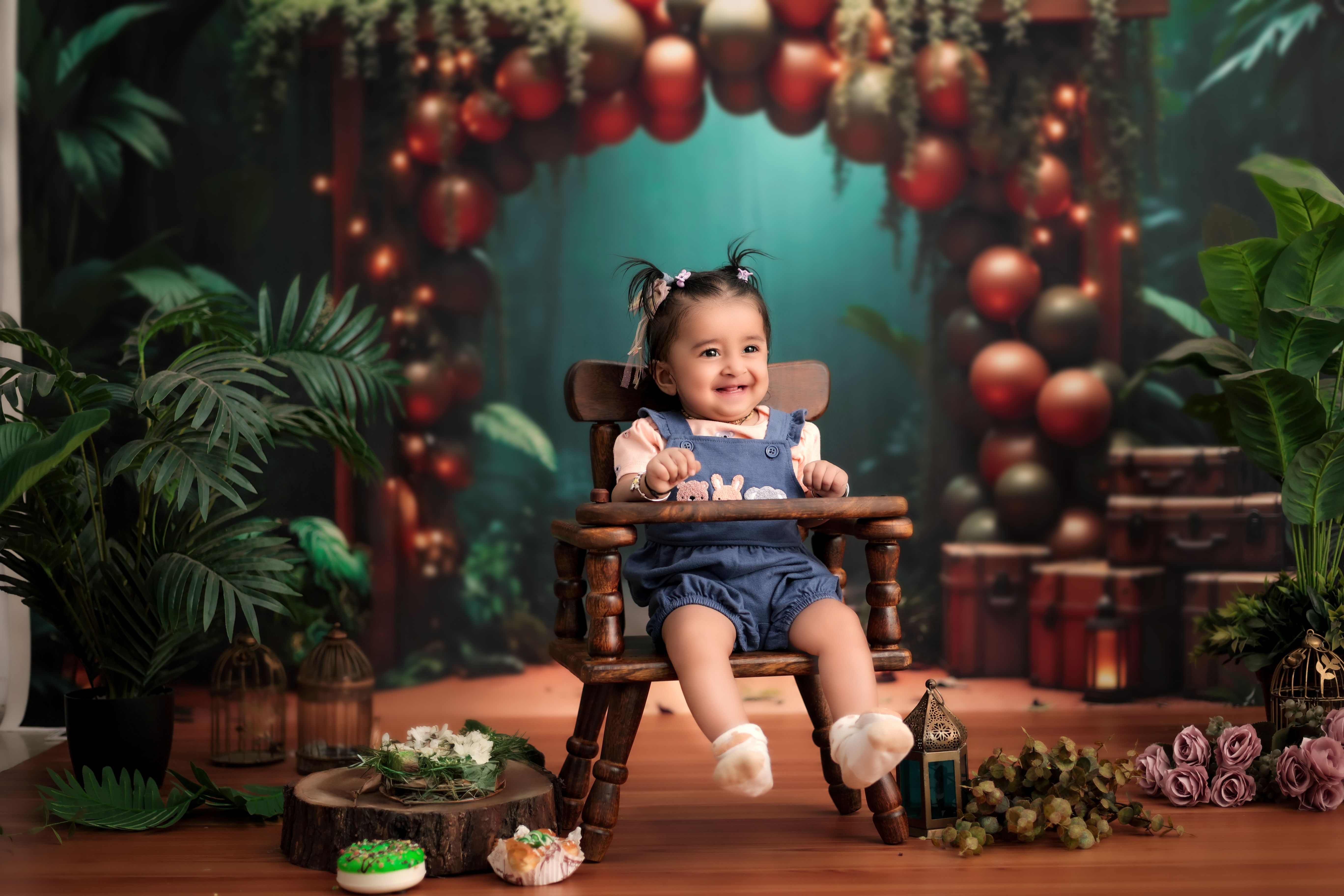 Adorable Baby Girl Sitting Amidst Tropical Backdrop · Free Stock Photo