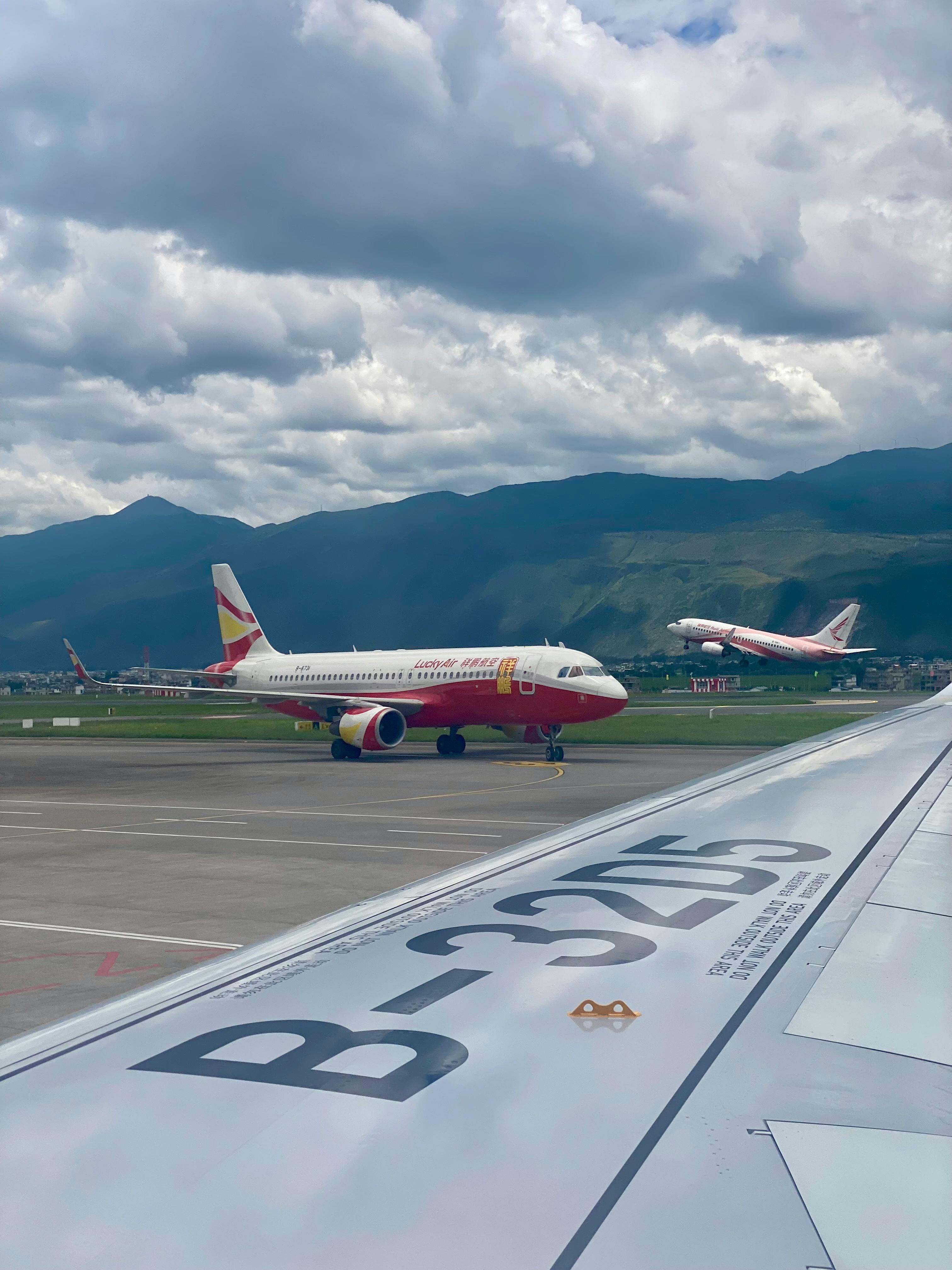 Commercial Jets on Runway with Mountain View · Free Stock Photo