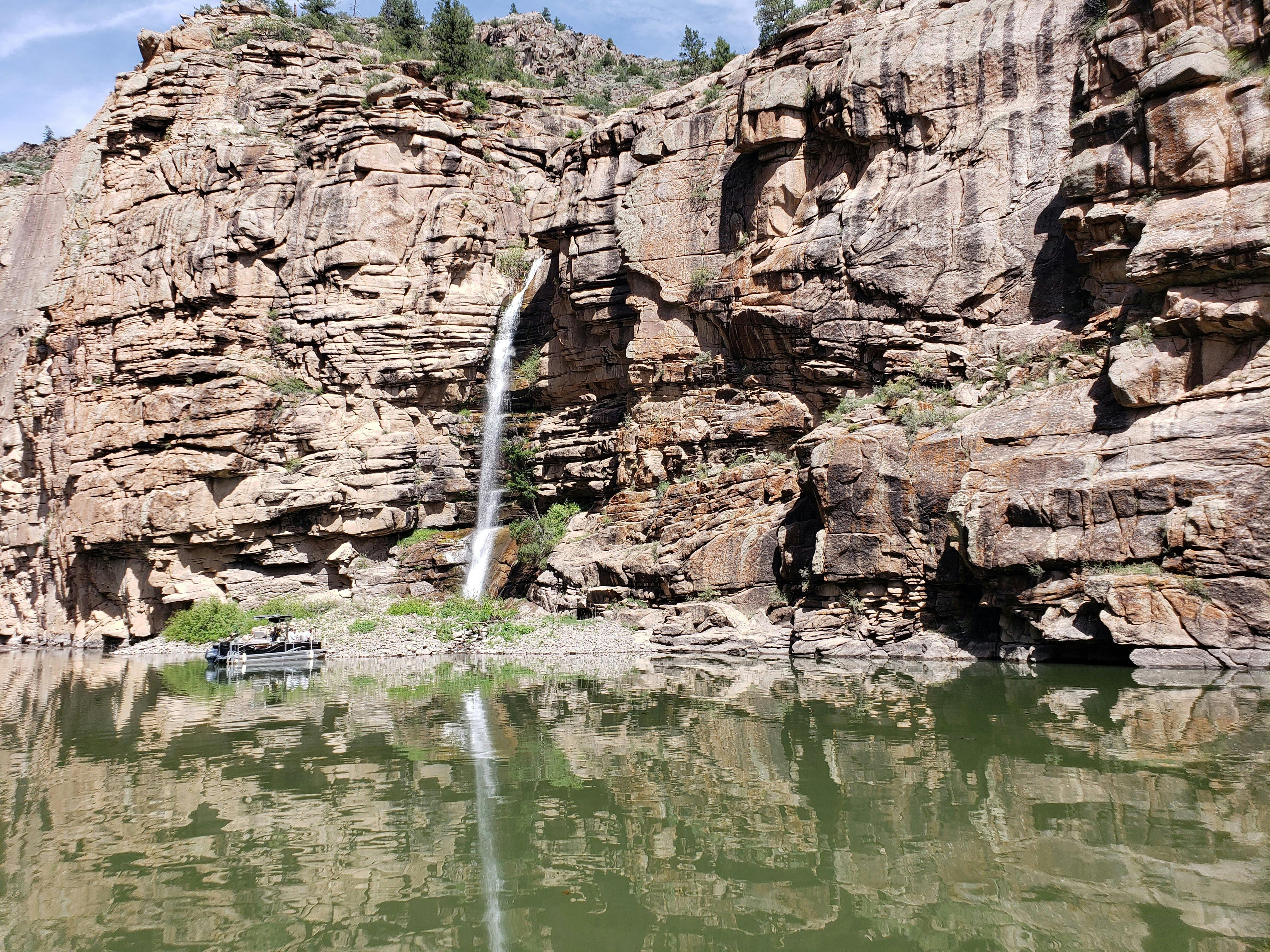 Scenic Rocky Waterfall Reflection · Free Stock Photo