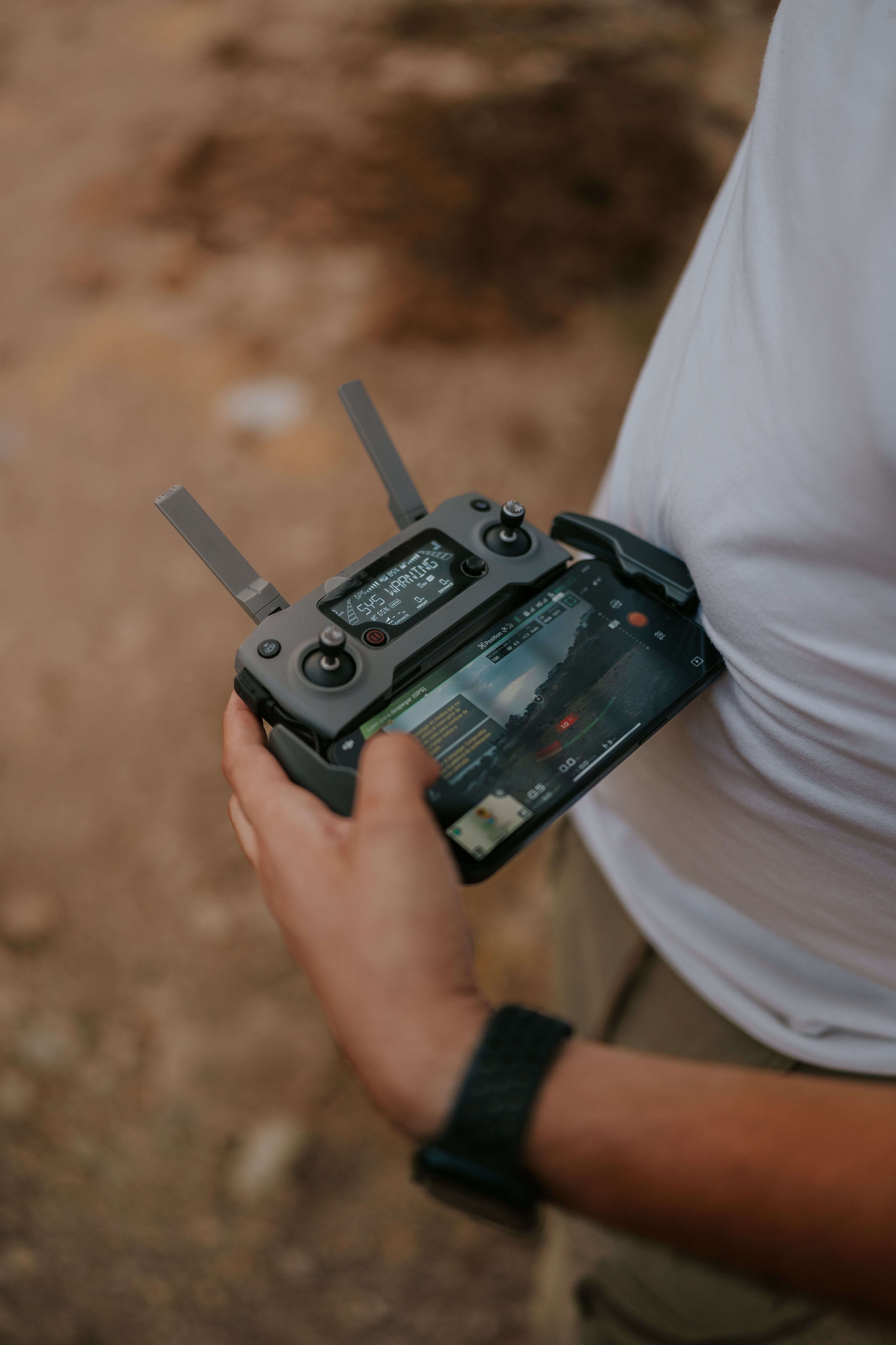 Man Operating Drone with Remote Control Outdoors · Free Stock Photo