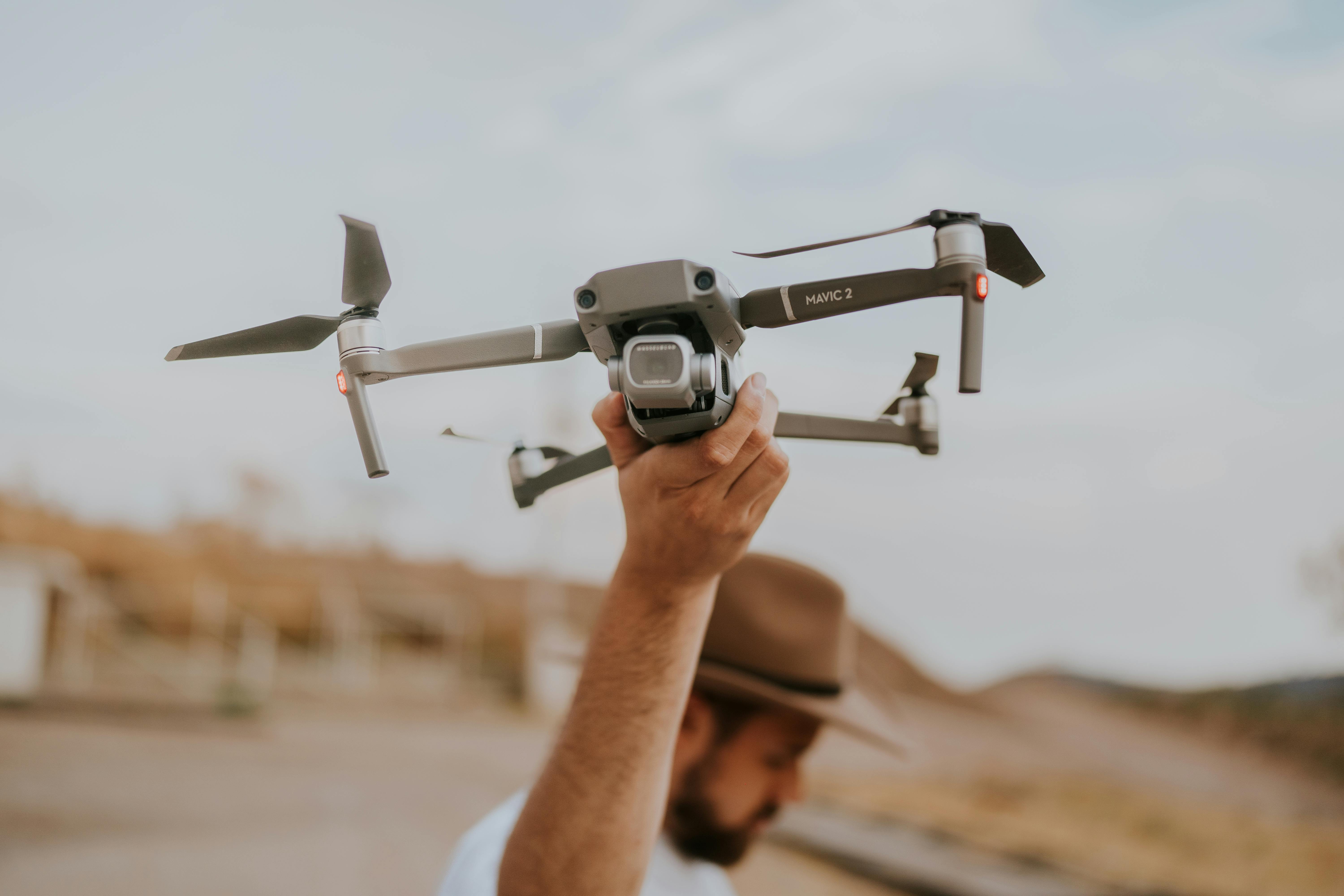 Man Holding DJI Drone Outdoors · Free Stock Photo