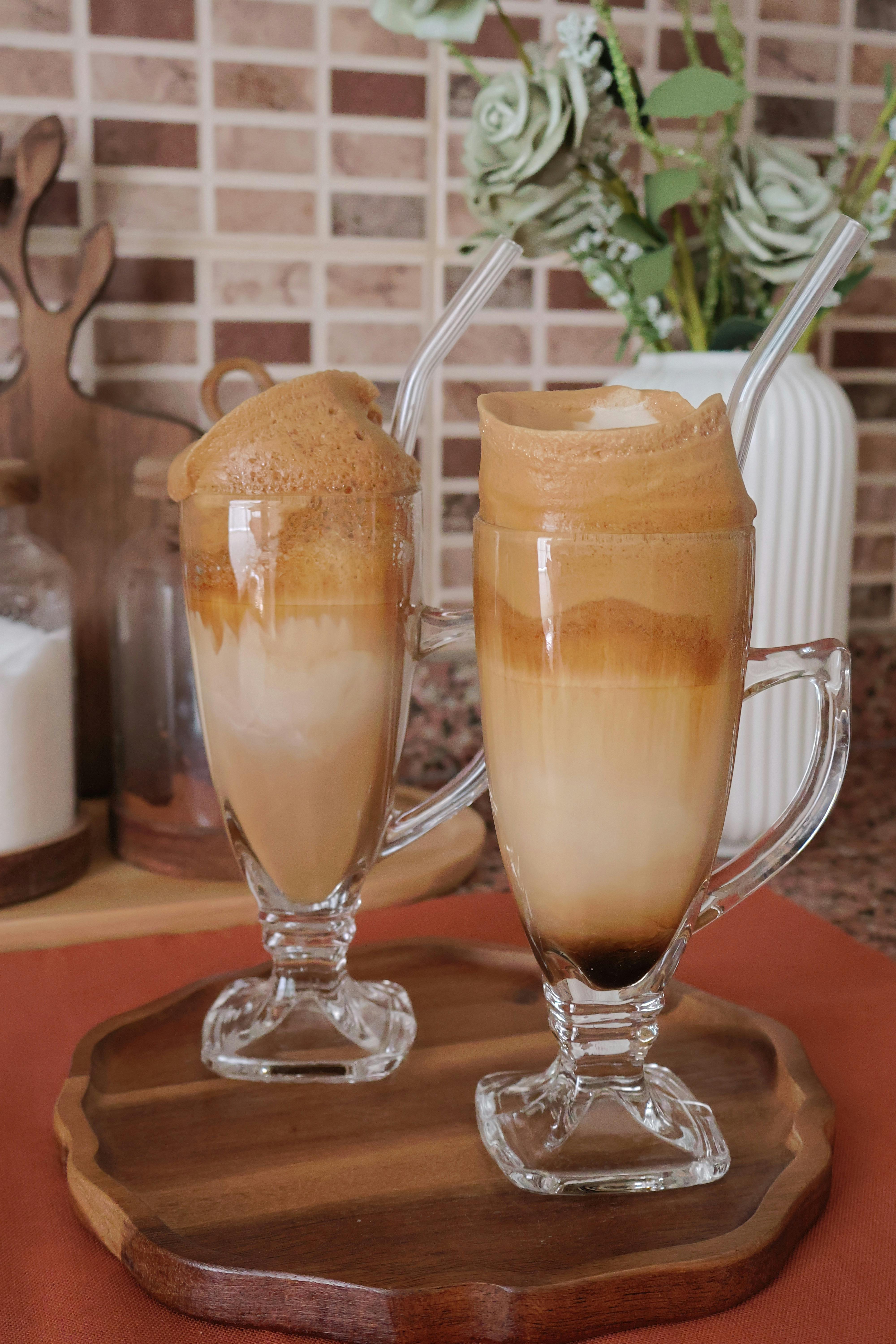 Frothy Iced Coffee in Tall Glasses on Wooden Tray · Free Stock Photo