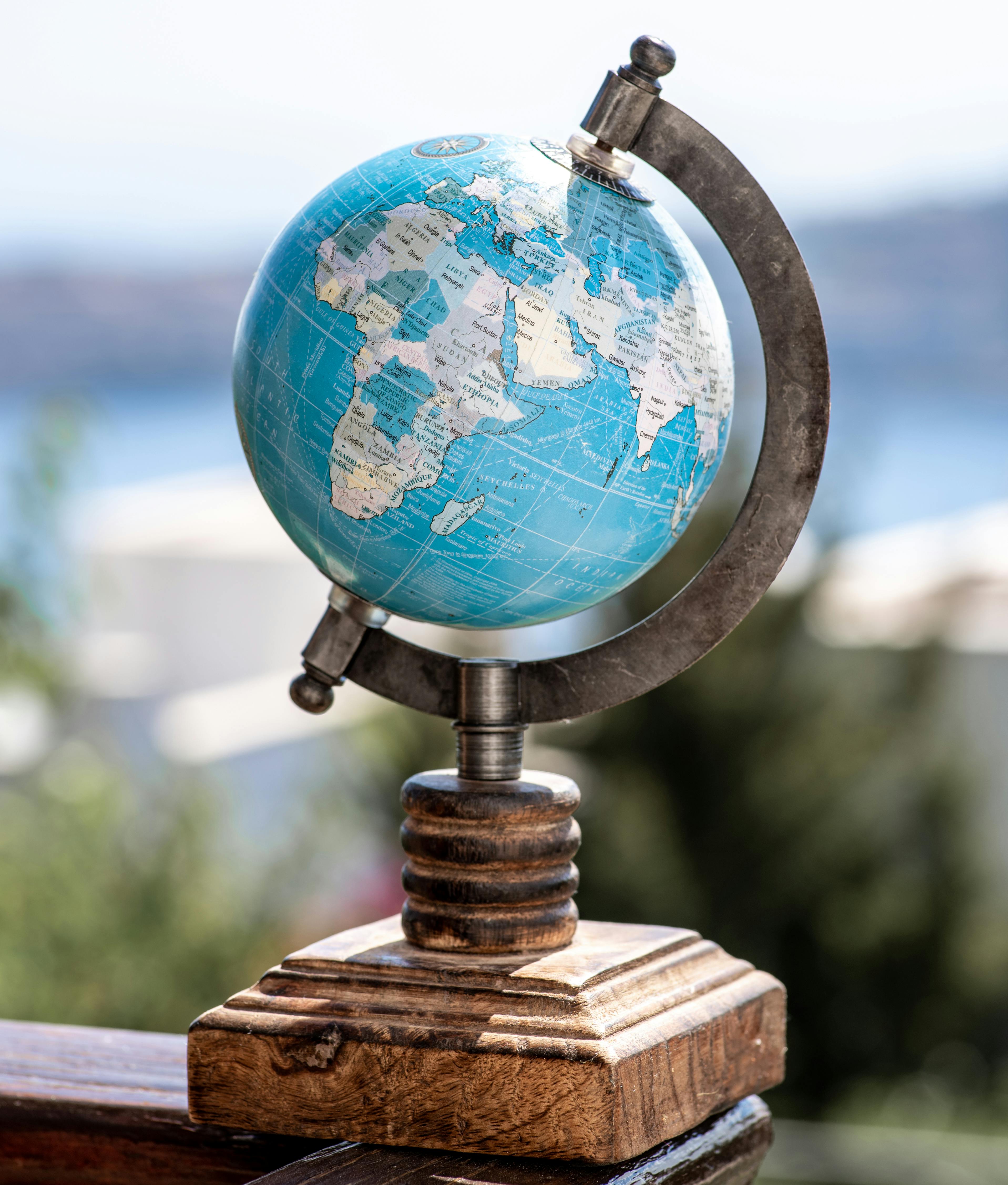 Rustic Globe Display in Mediterranean Setting · Free Stock Photo
