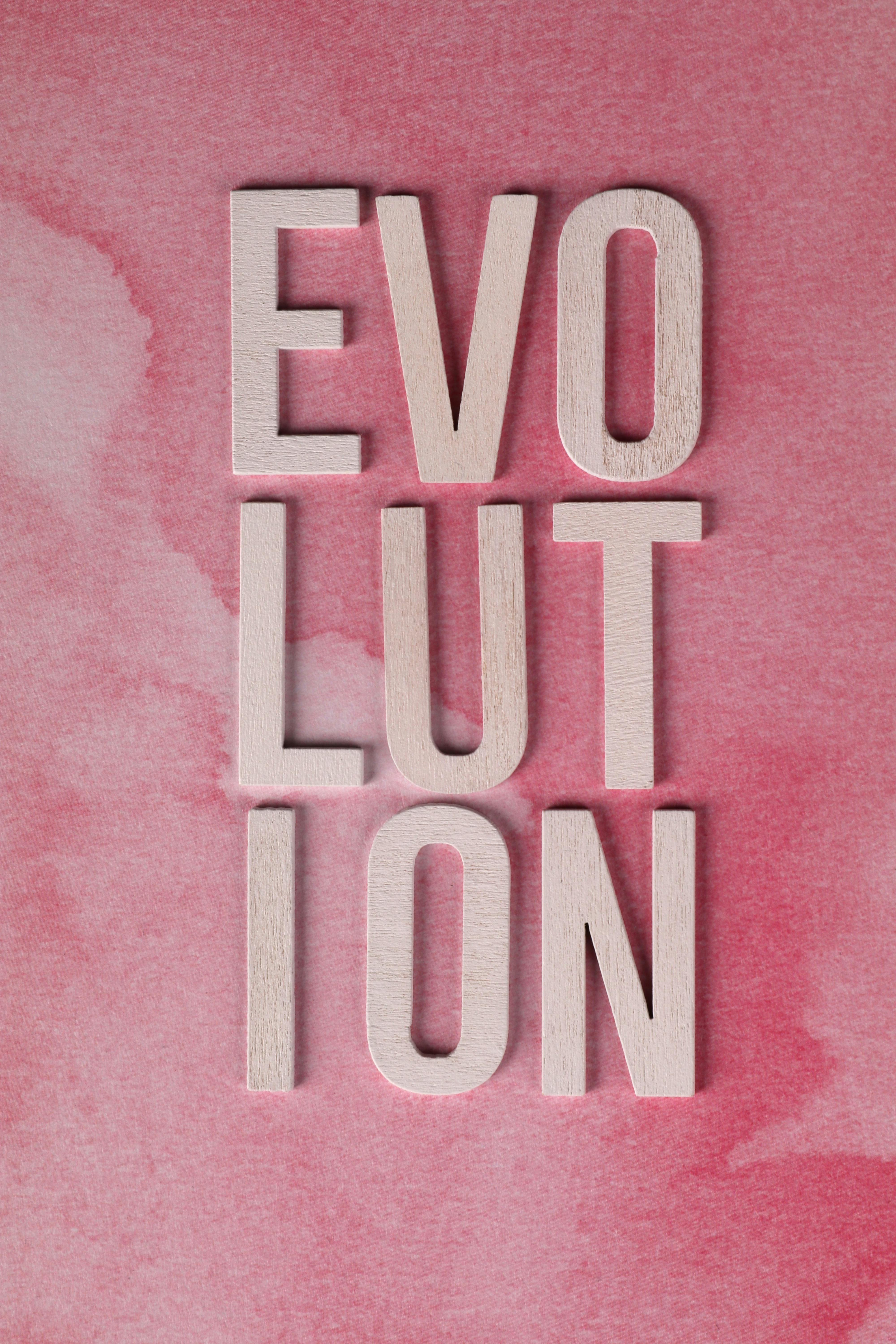 Abstract Word Evolution on Textured Background · Free Stock Photo
