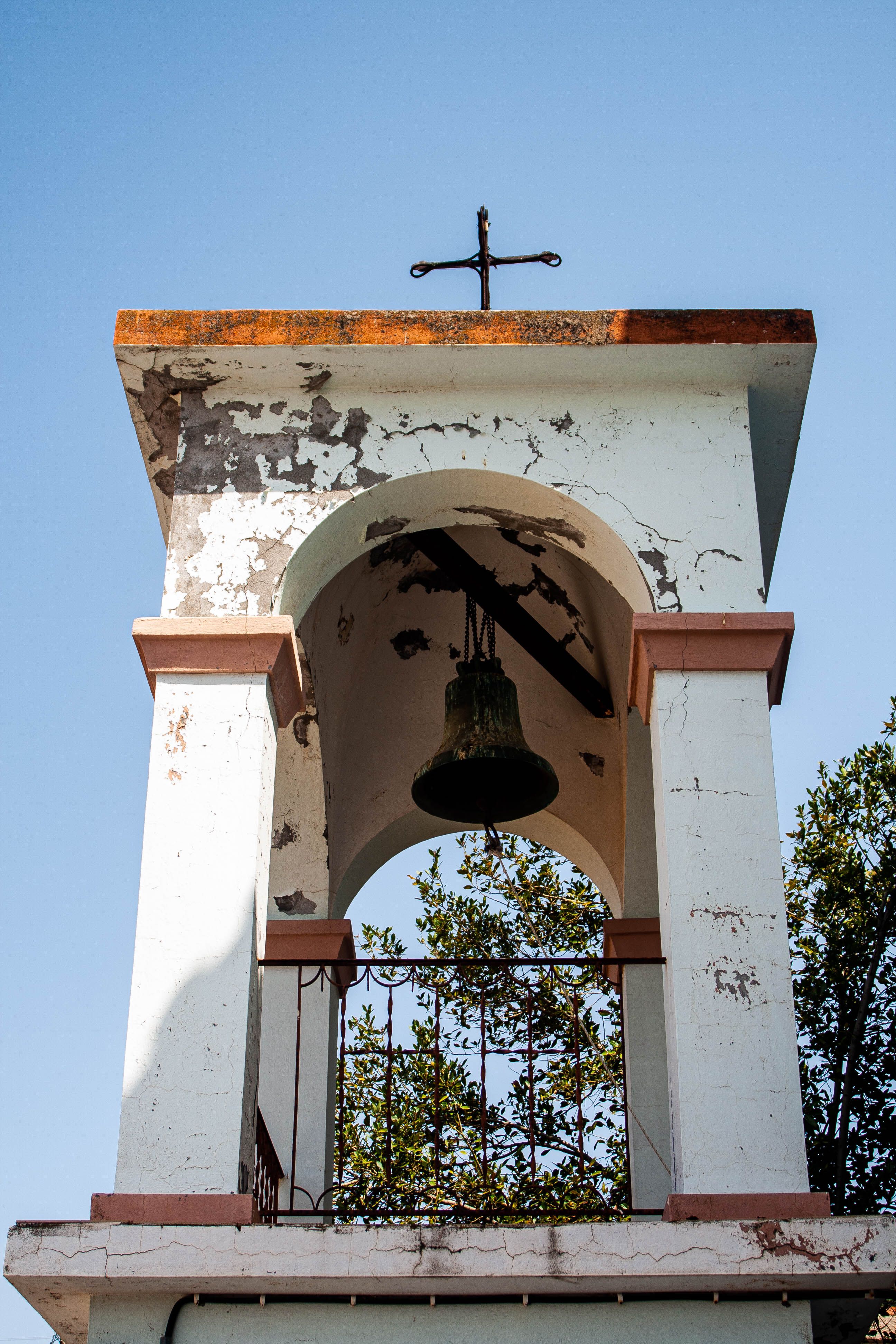Rustic Bell Tower Against Clear Blue Sky · Free Stock Photo