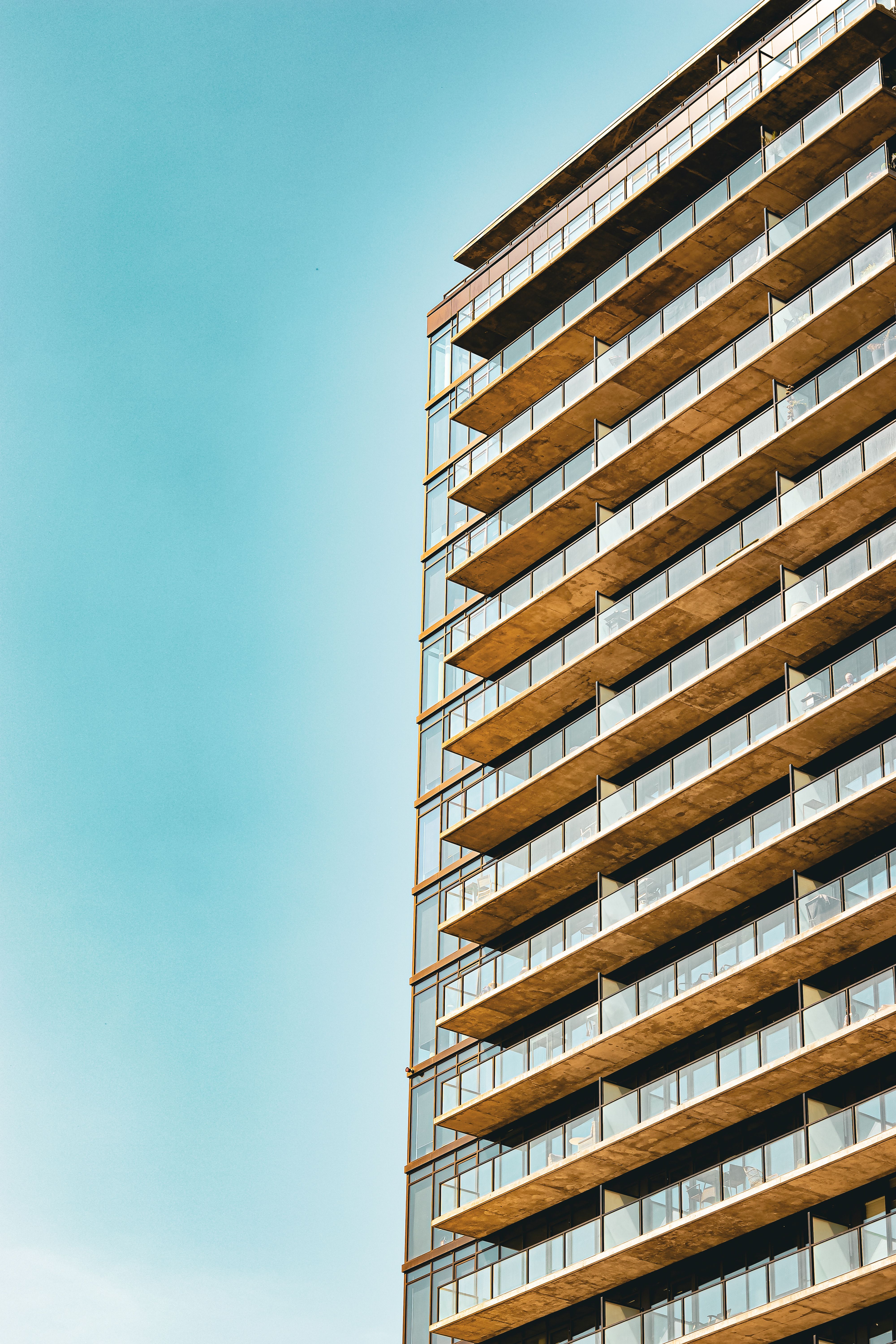 Modern High-Rise Building Against Clear Sky · Free Stock Photo