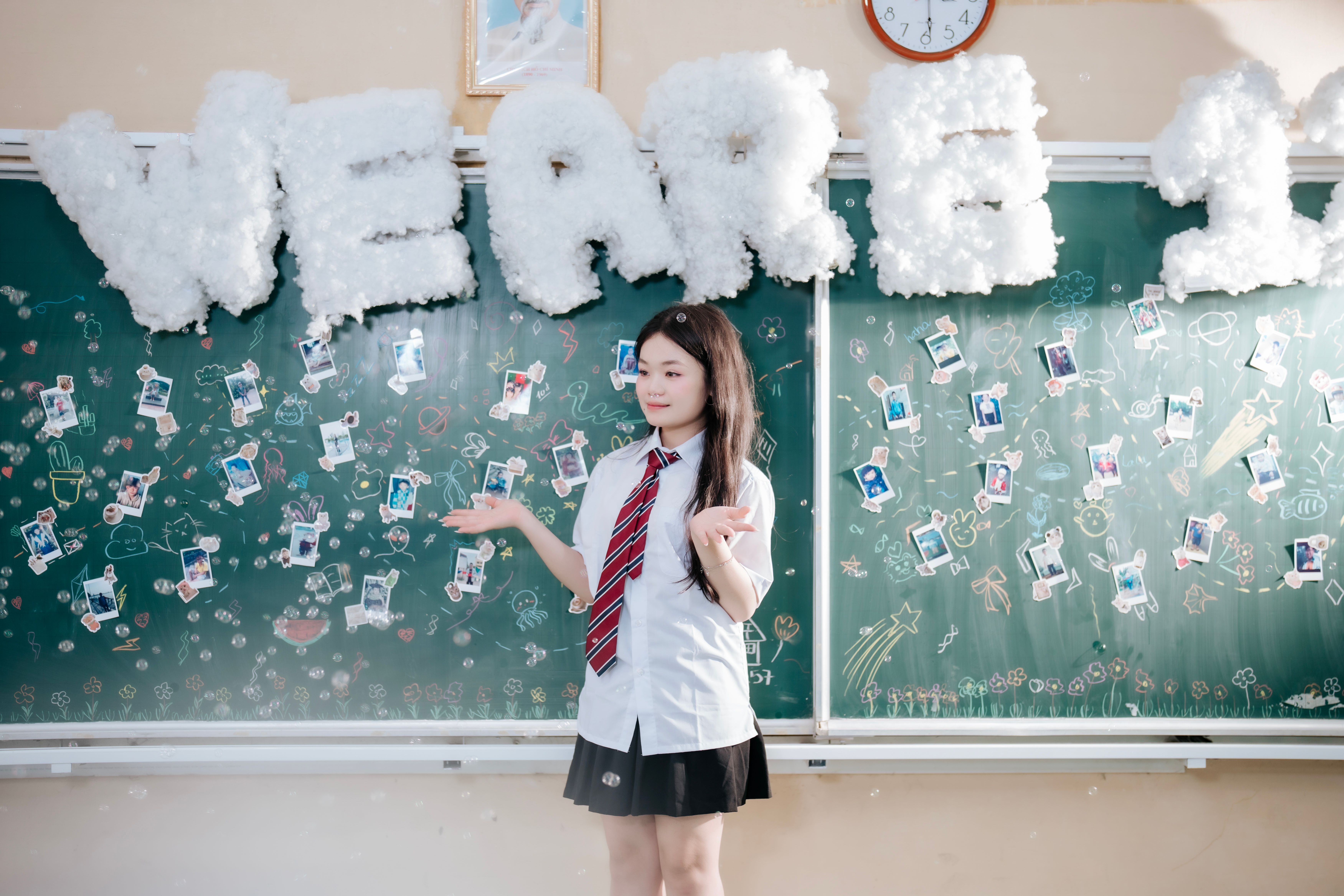 Student Celebrating Graduation in Classroom Setting · Free Stock Photo