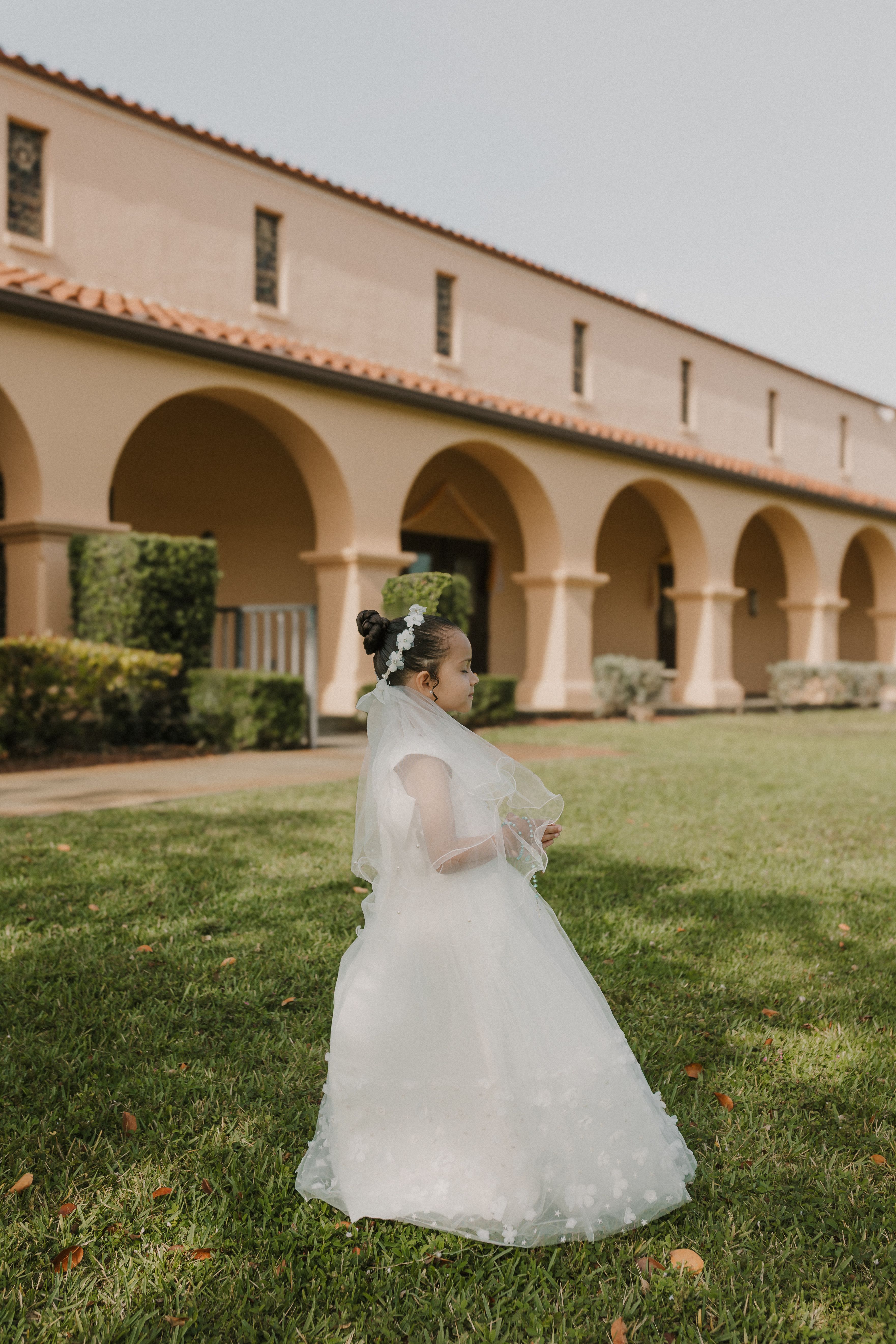 Young Girl in Communion Dress Outdoors · Free Stock Photo