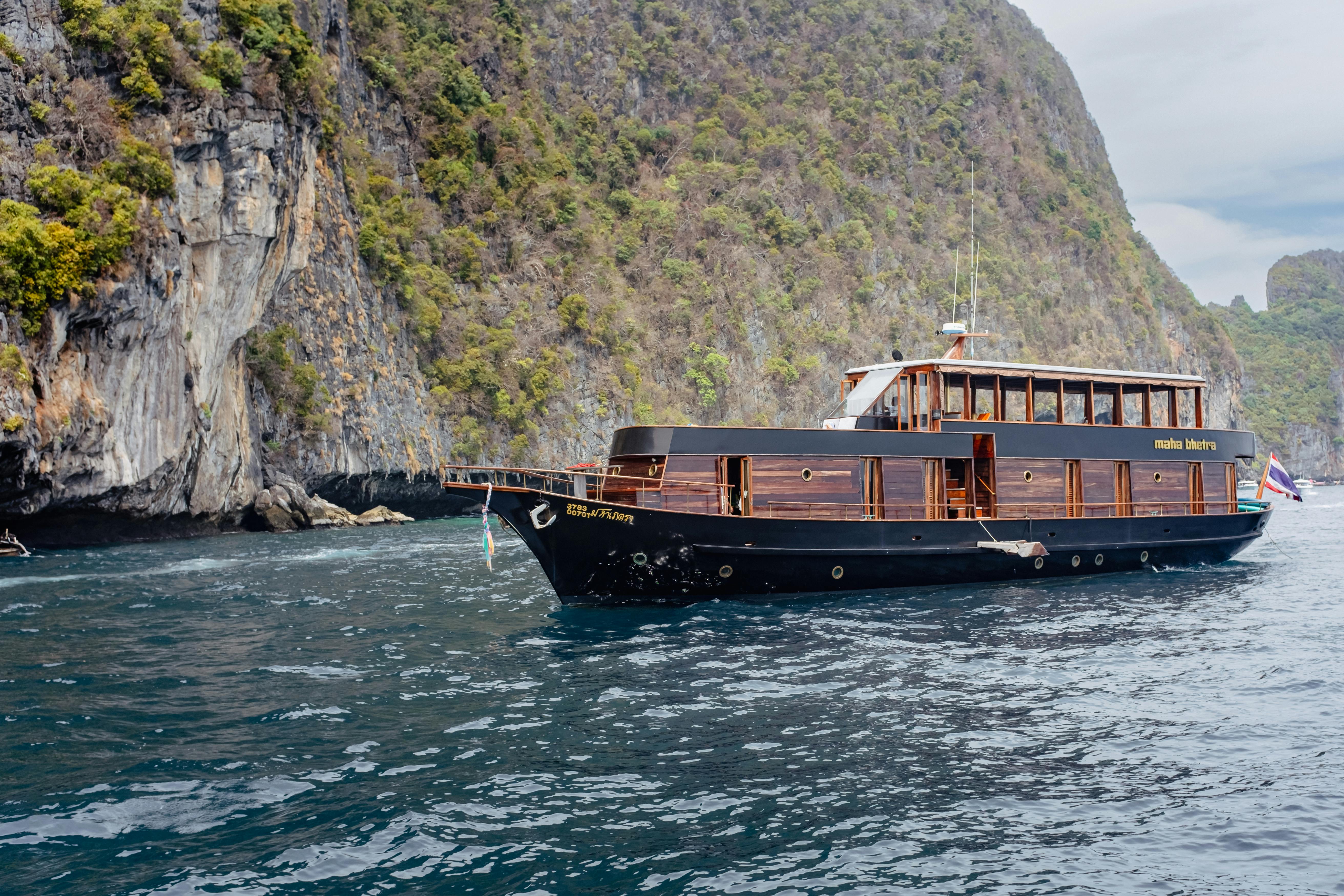 Luxury Yacht Cruising by Limestone Cliffs · Free Stock Photo