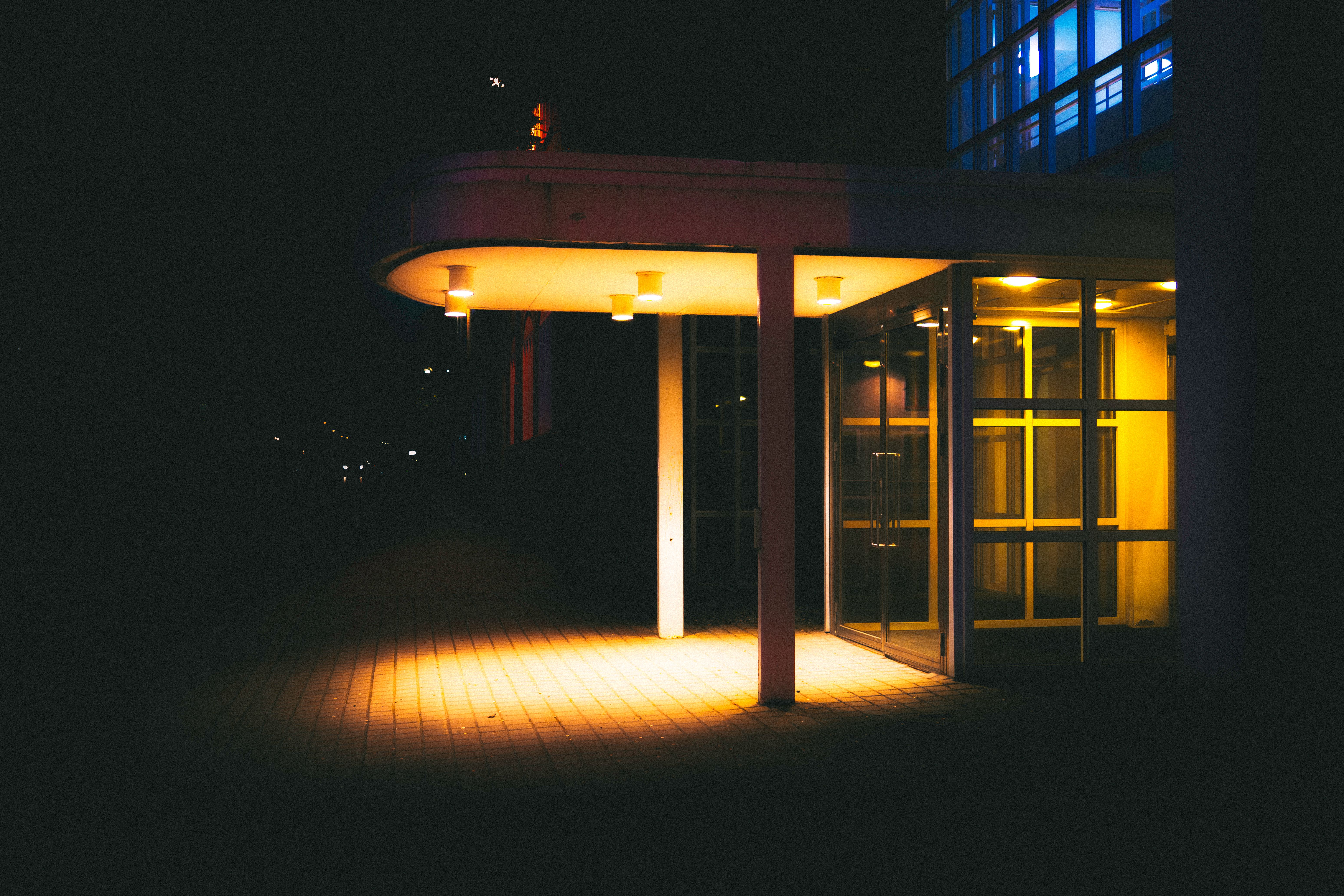 Nighttime Illuminated Entrance with Warm Lighting · Free Stock Photo