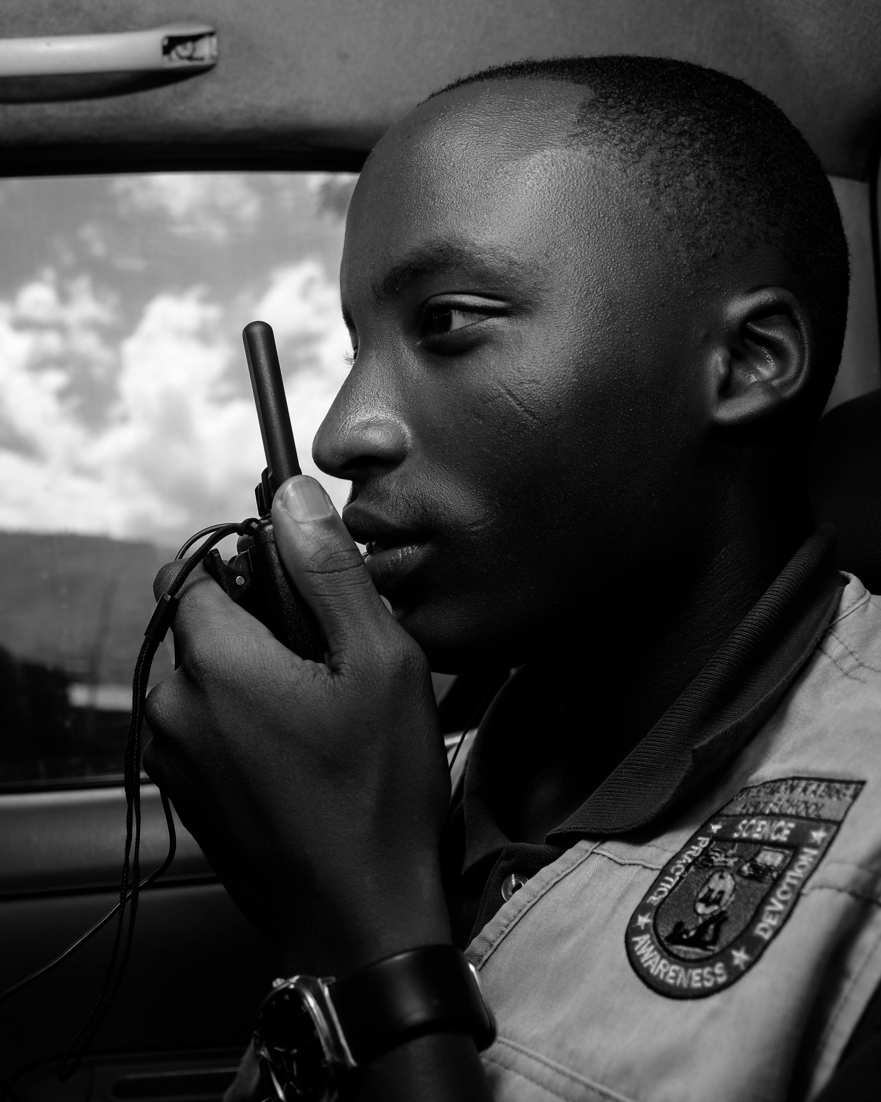 Black and White Portrait of Rwandan Man with Radio · Free Stock Photo