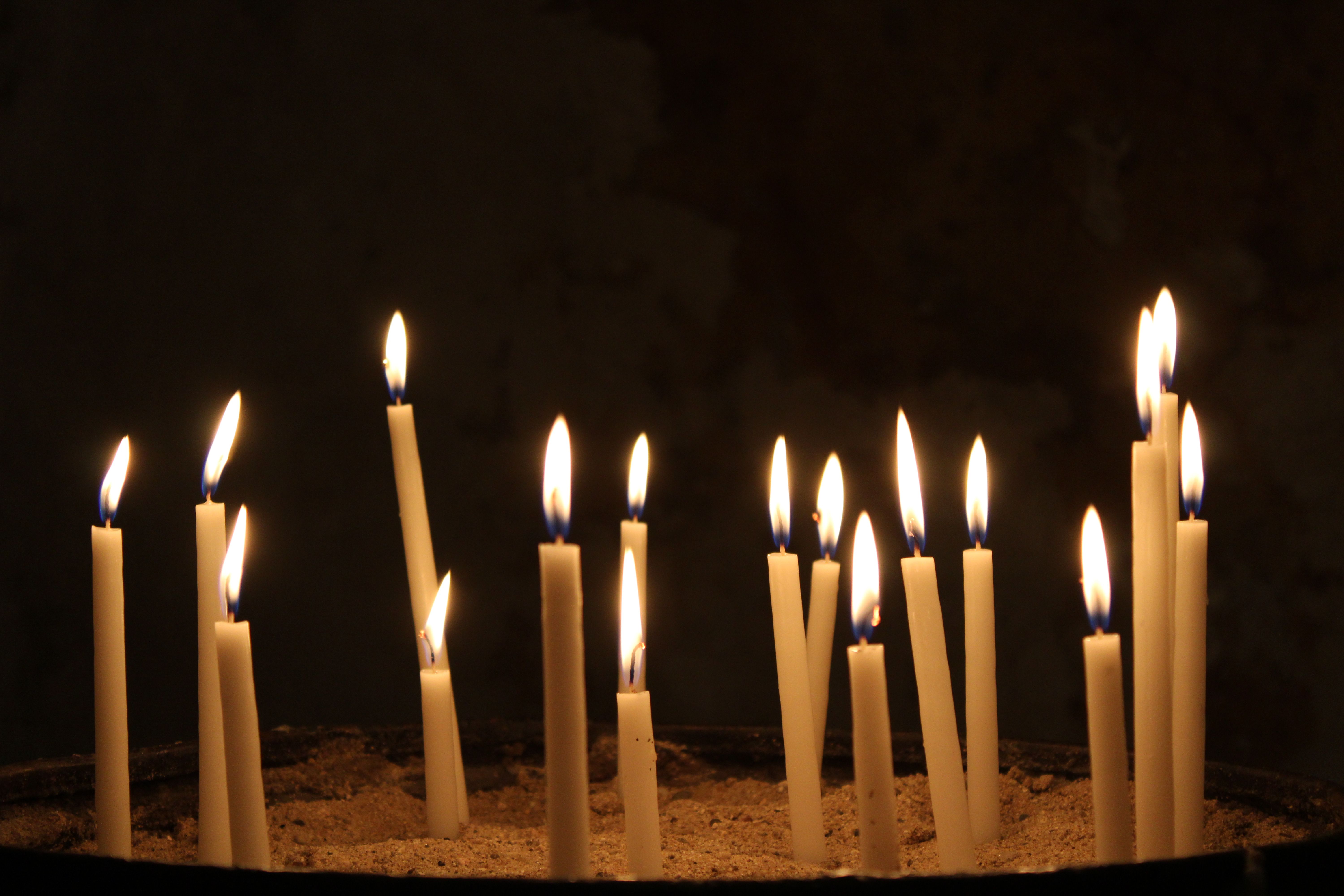 Candlelit Ritual with Vibrant Red Candles · Free Stock Photo