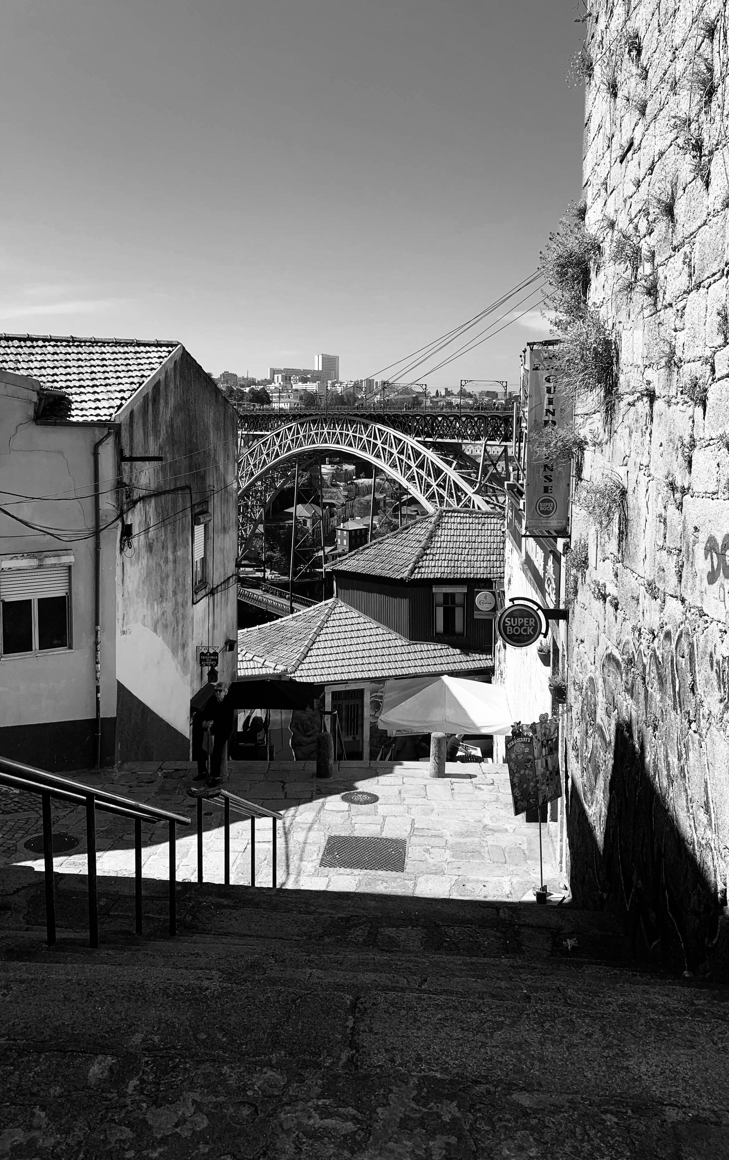 Black and White Urban Street with Bridge View · Free Stock Photo
