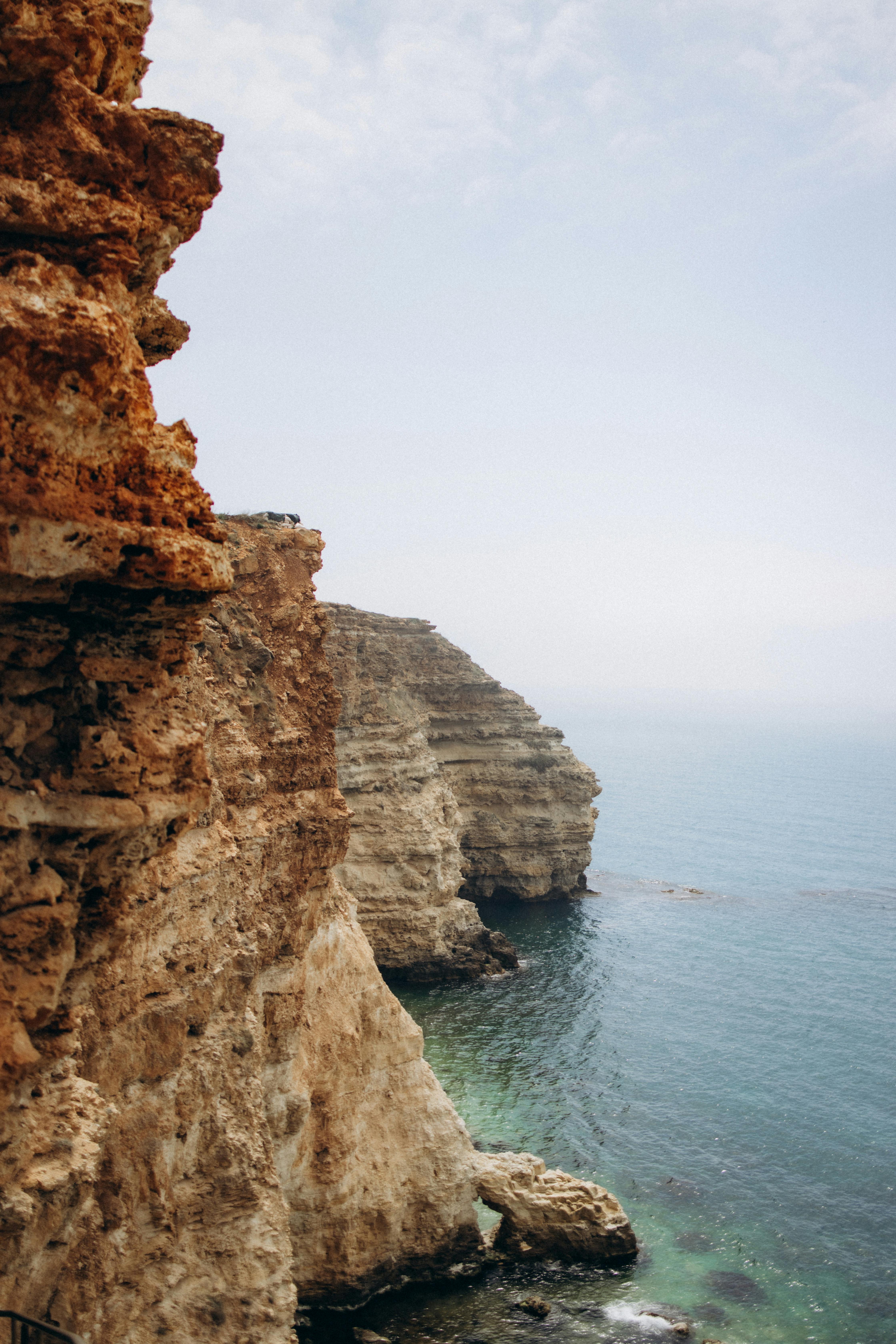 Scenic Coastal Cliff View with Ocean Horizon · Free Stock Photo