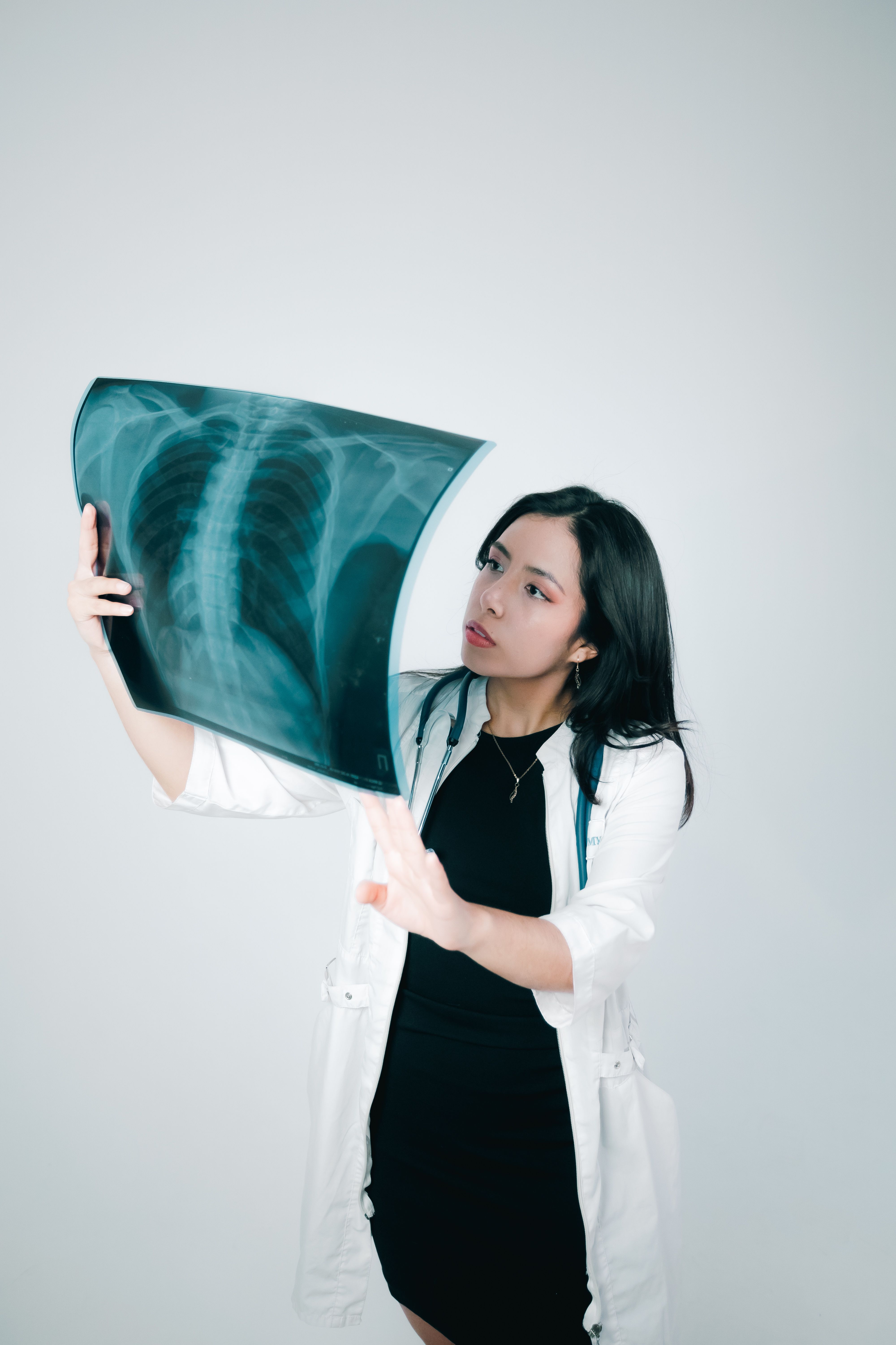Healthcare Professional Examining Chest X-ray · Free Stock Photo