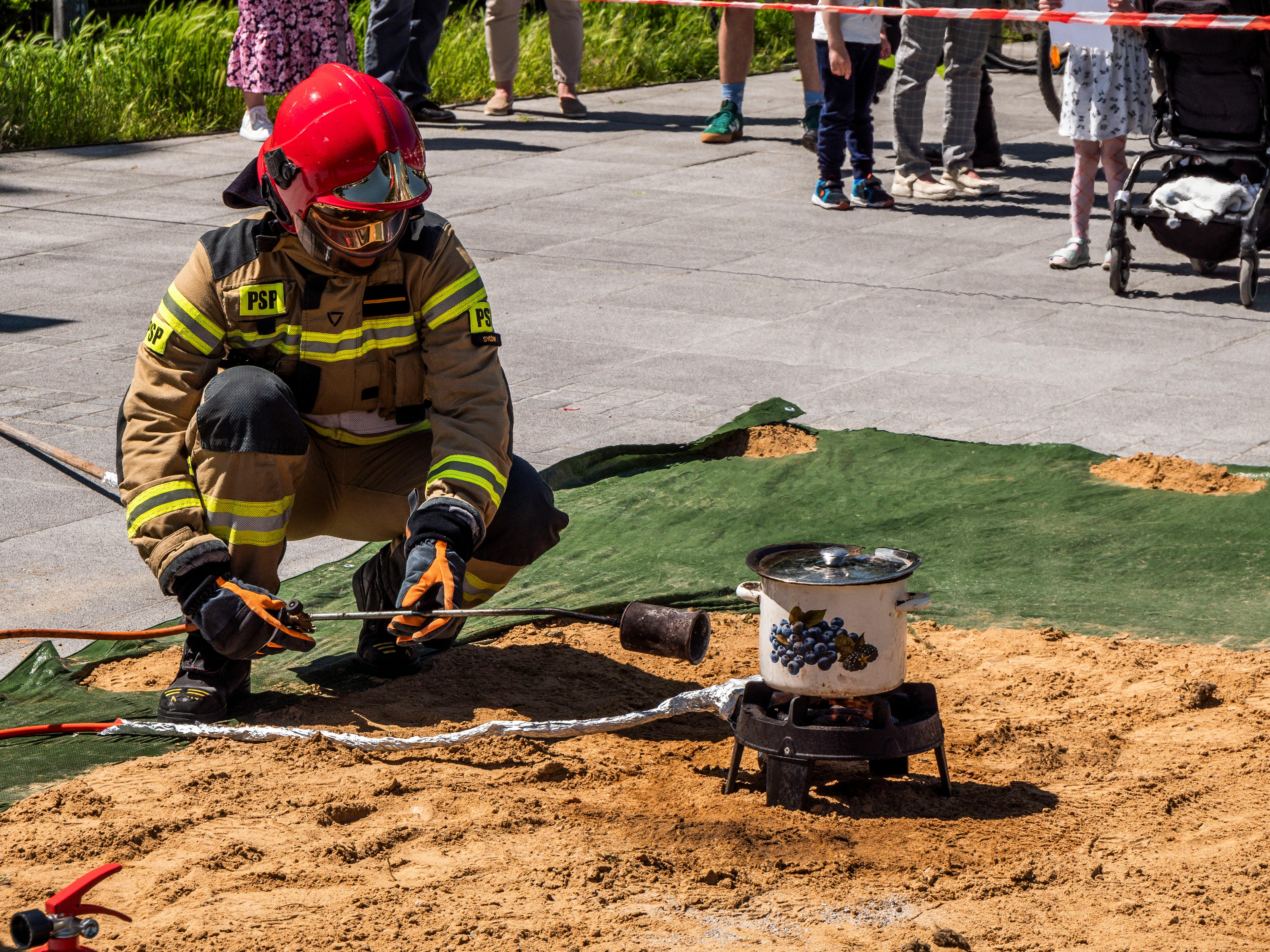 Firefighter Demonstrating Safety in Outdoor Drill · Free Stock Photo