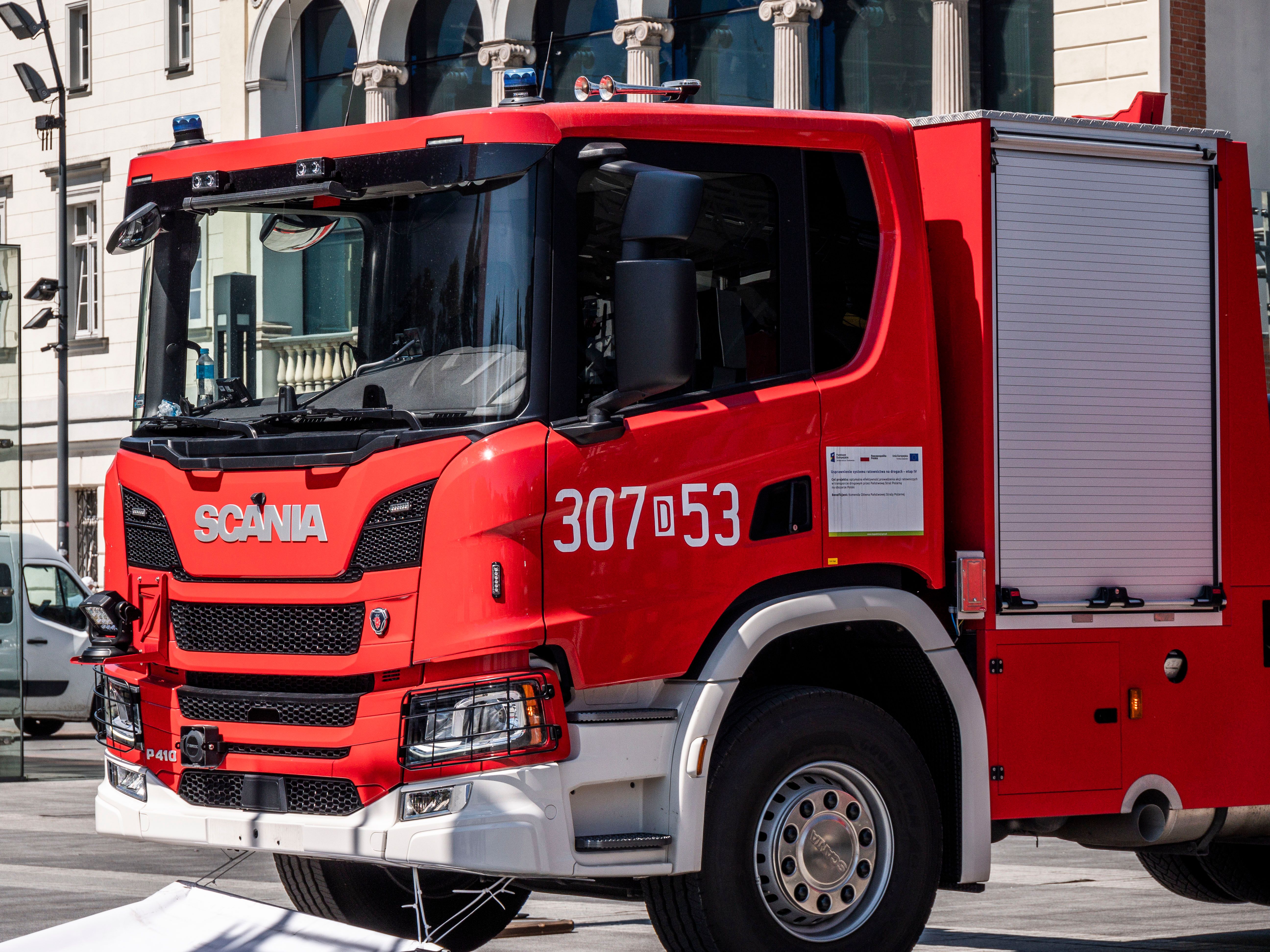 Red Fire Truck in Urban Setting Daytime · Free Stock Photo