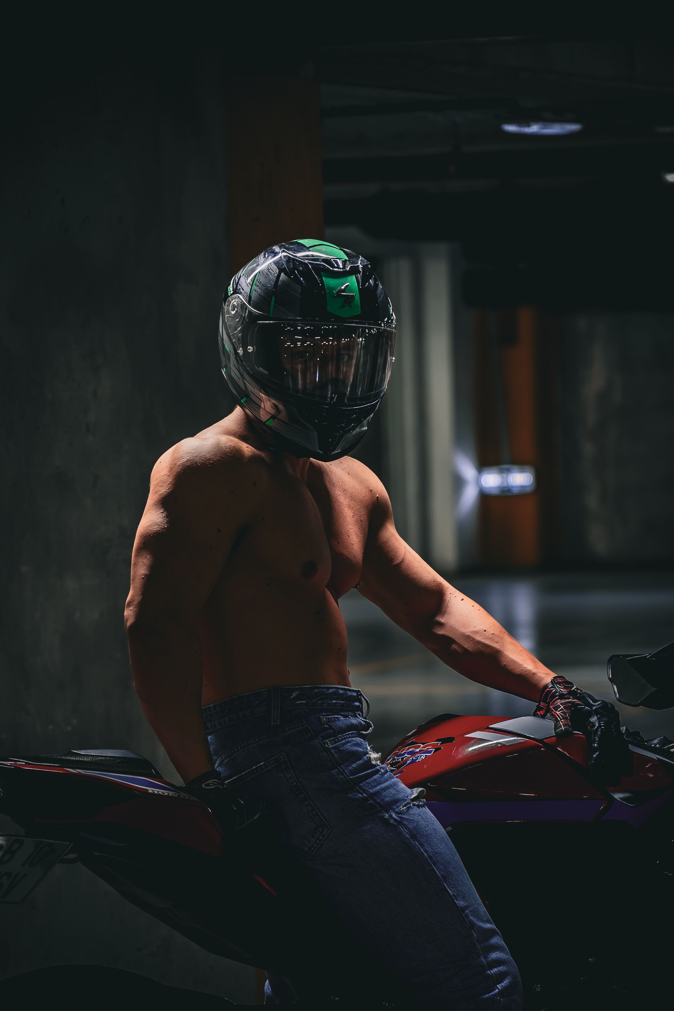 Muscular Biker in Helmet Posing with Motorcycle · Free Stock Photo