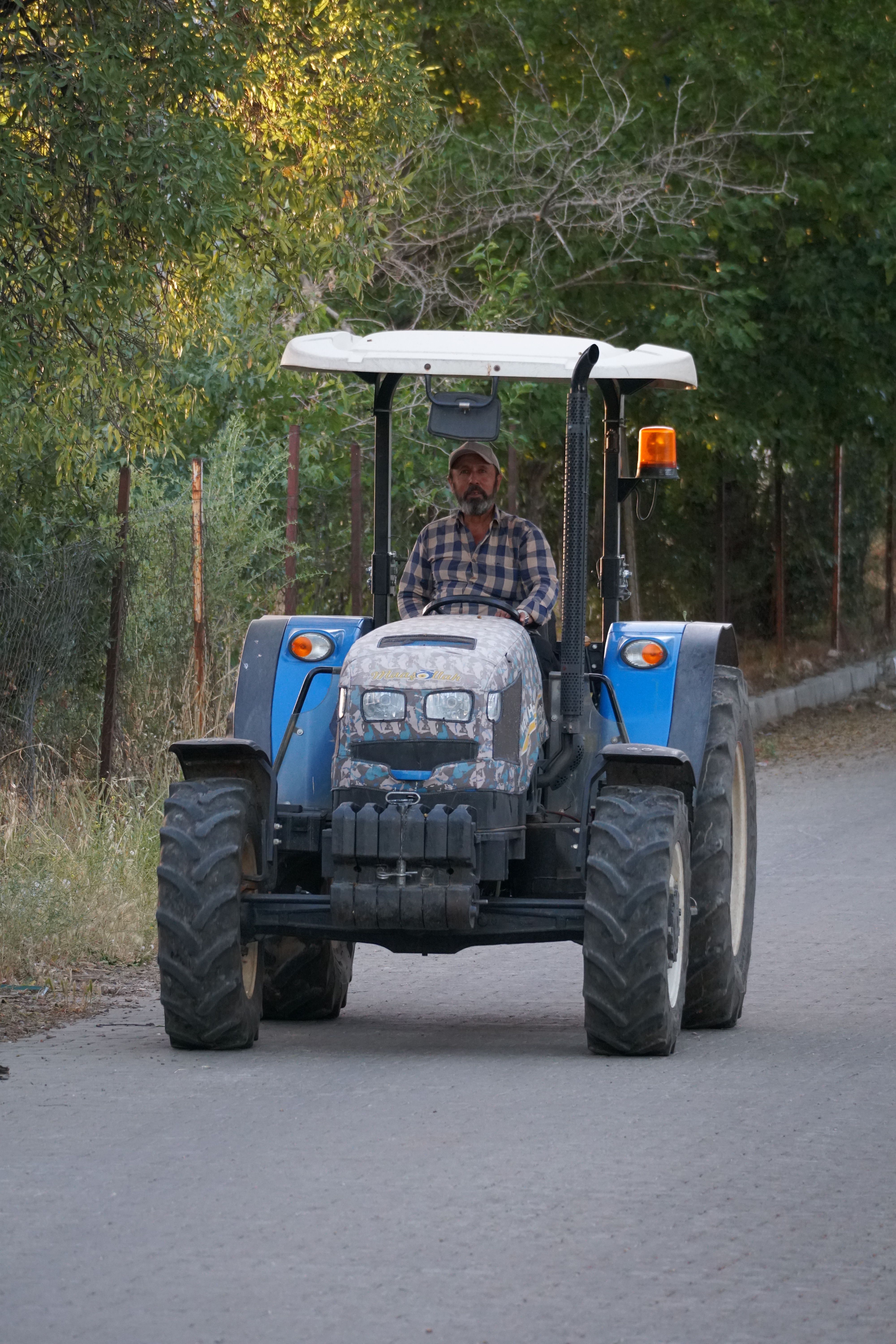 Man Sitting on Tractor · Free Stock Photo